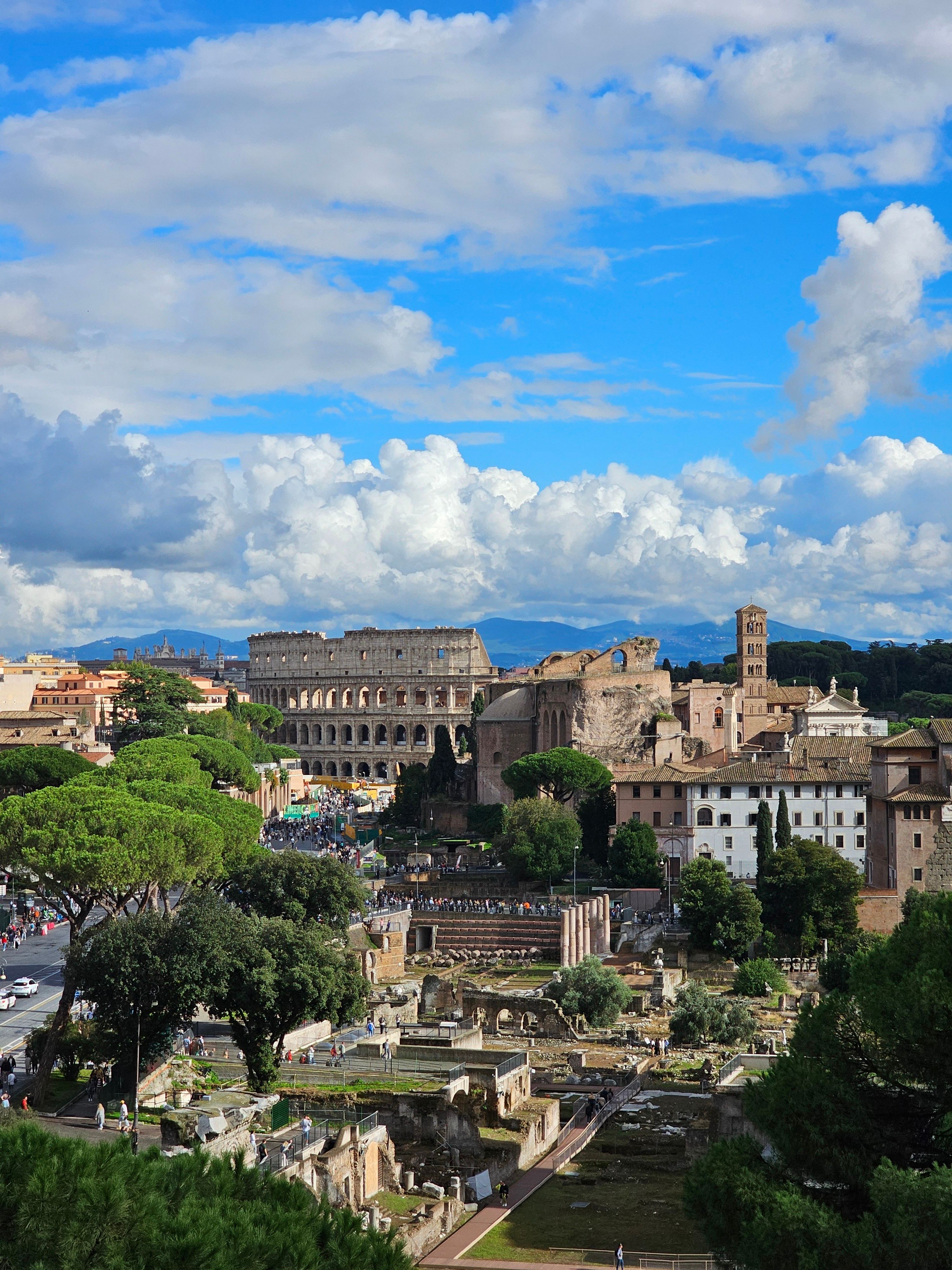 Historic Rome Skyline Featuring the Colosseum · Free Stock Photo