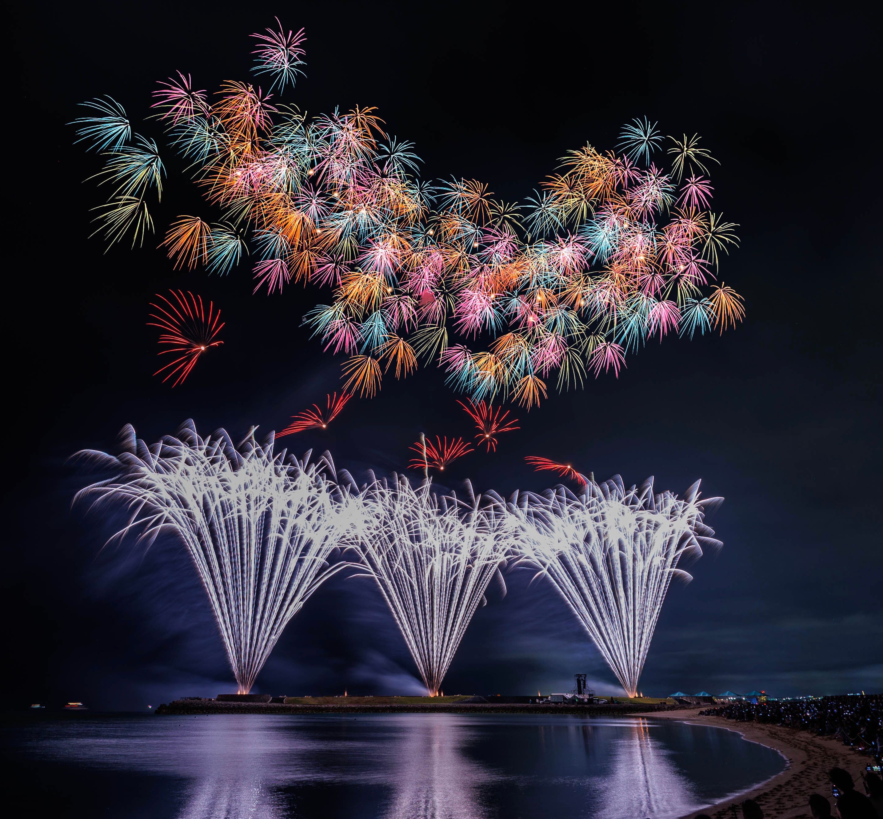 Spectacular Fireworks Display Over Water at Night · Free Stock Photo