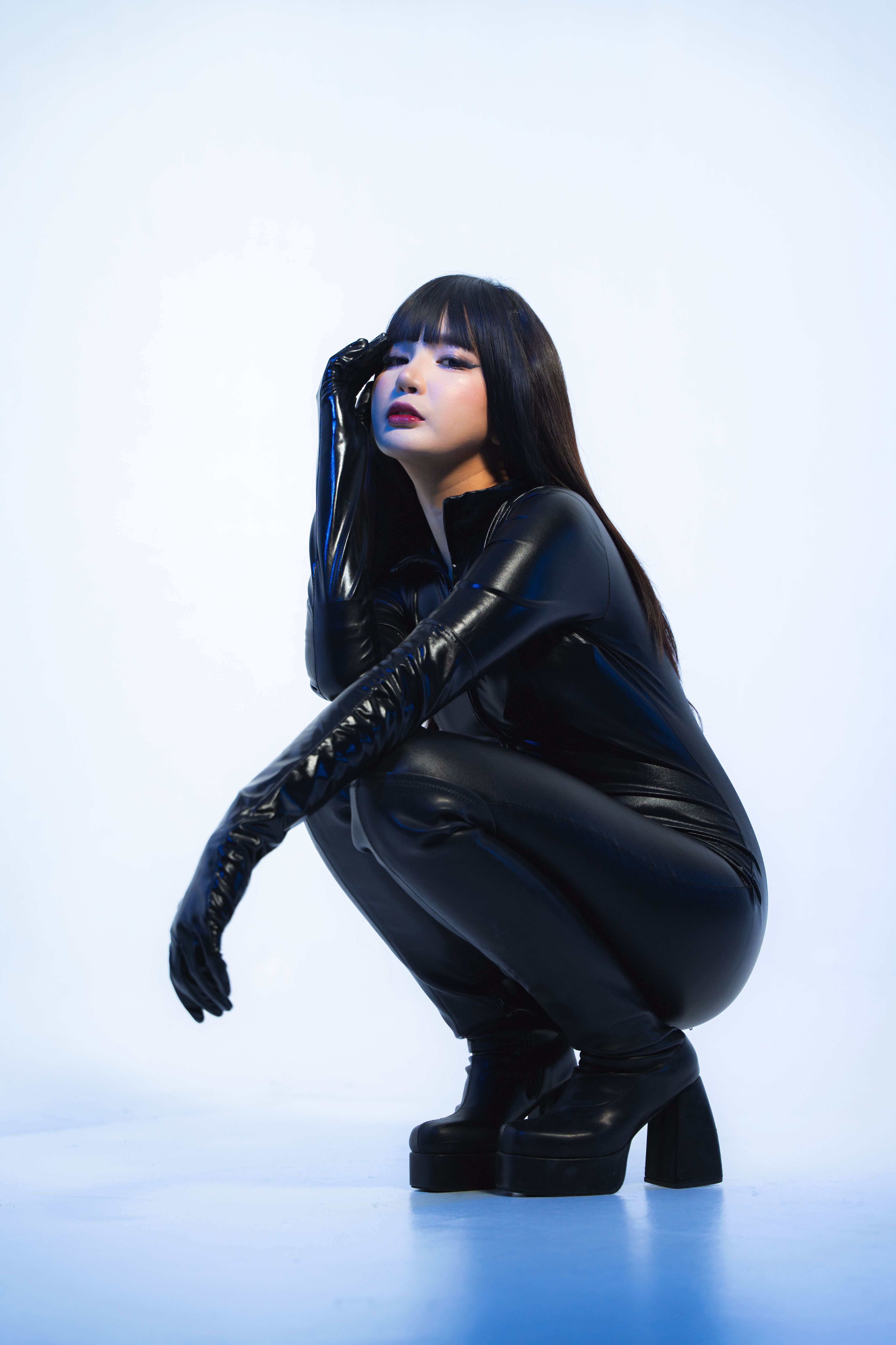 Fashion Portrait of a Woman in Black Vinyl Outfit · Free Stock Photo