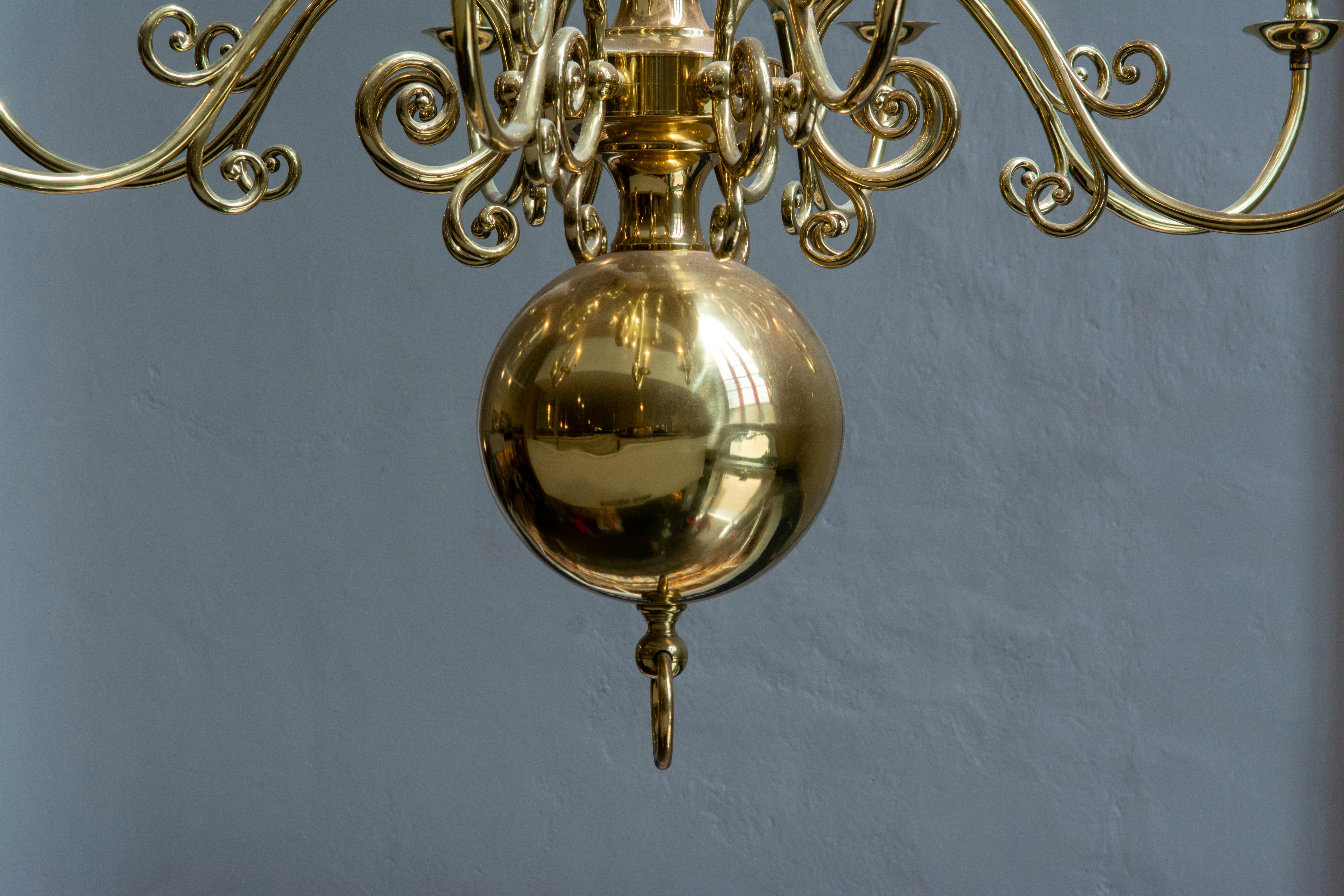 Elegant Brass Chandelier with Reflective Surface · Free Stock Photo