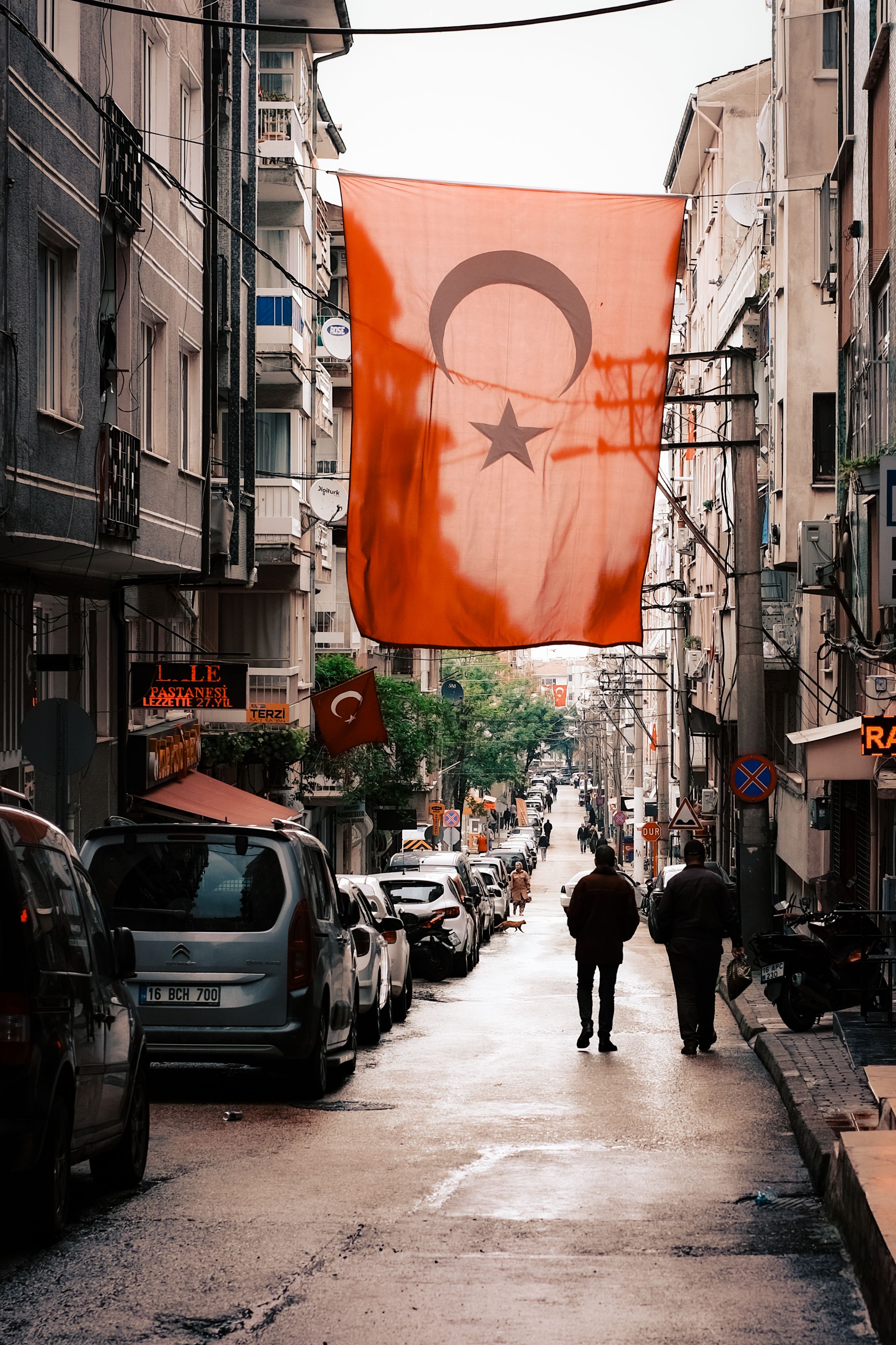 Turkish Flag on Urban Street under Cloudy Sky · Free Stock Photo