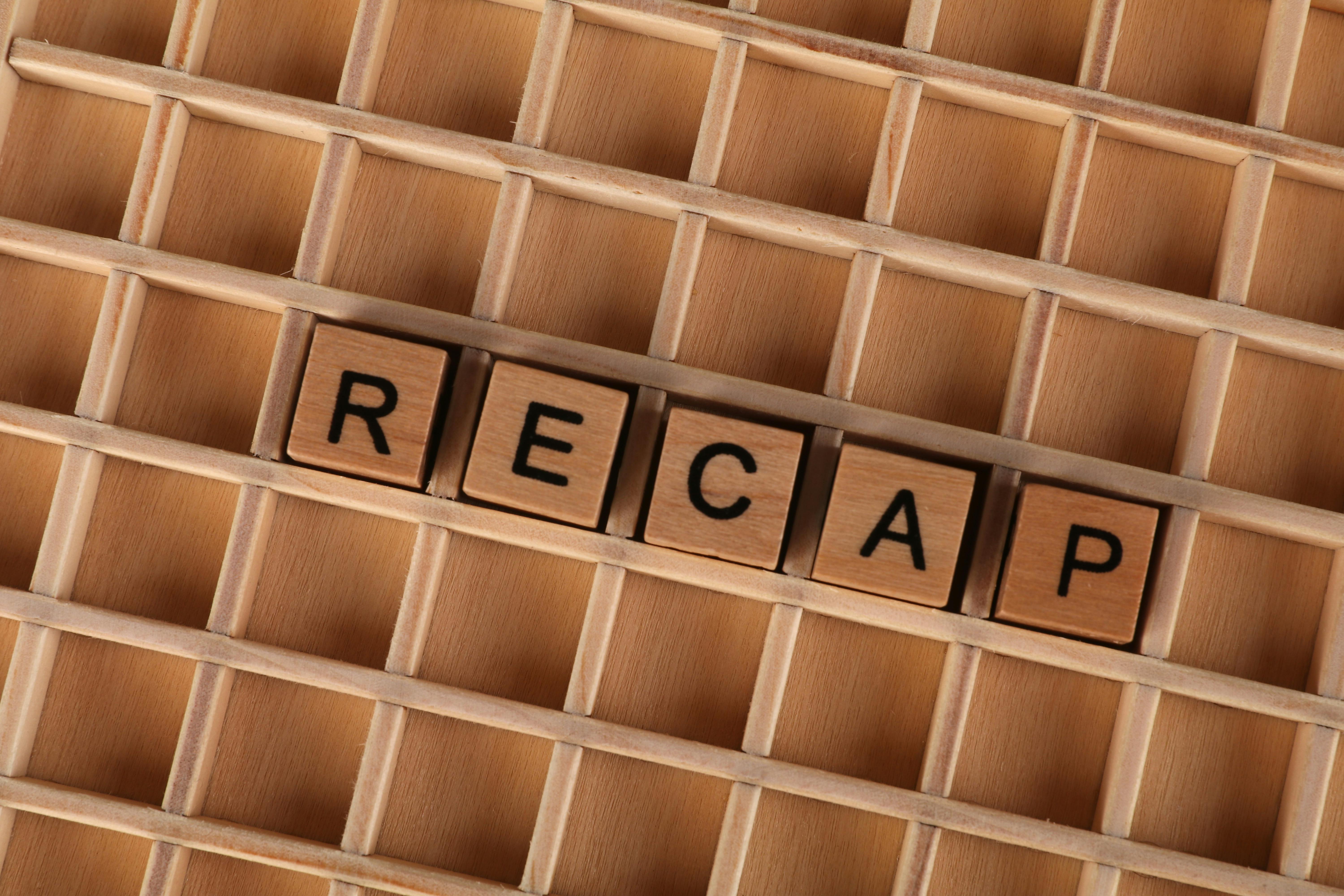Wooden Letter Blocks Spelling 'Recap' on Grid · Free Stock Photo