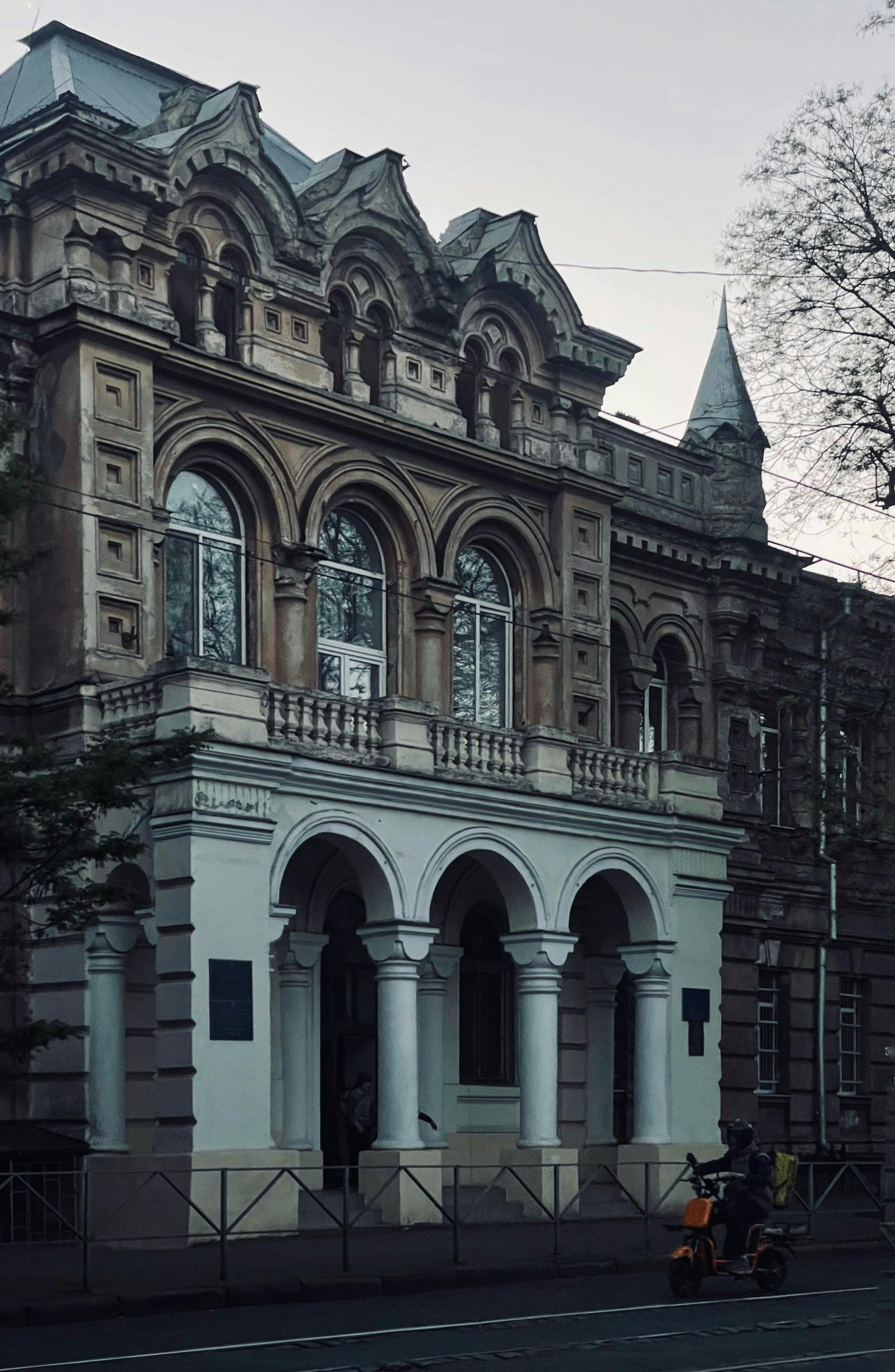 Historic European building facade at dusk · Free Stock Photo