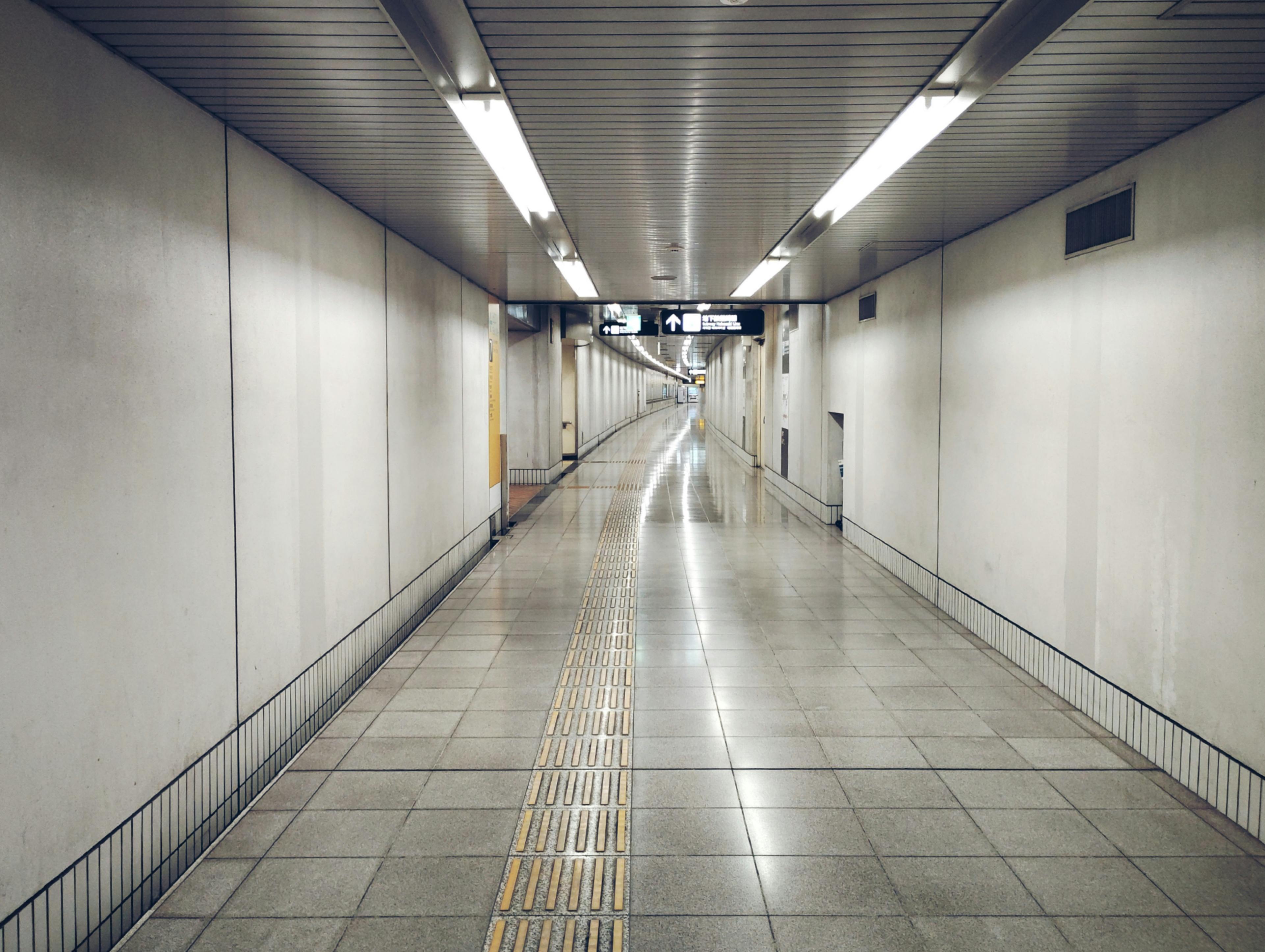 Empty Subway Hallway with Geometric Ceiling · Free Stock Photo
