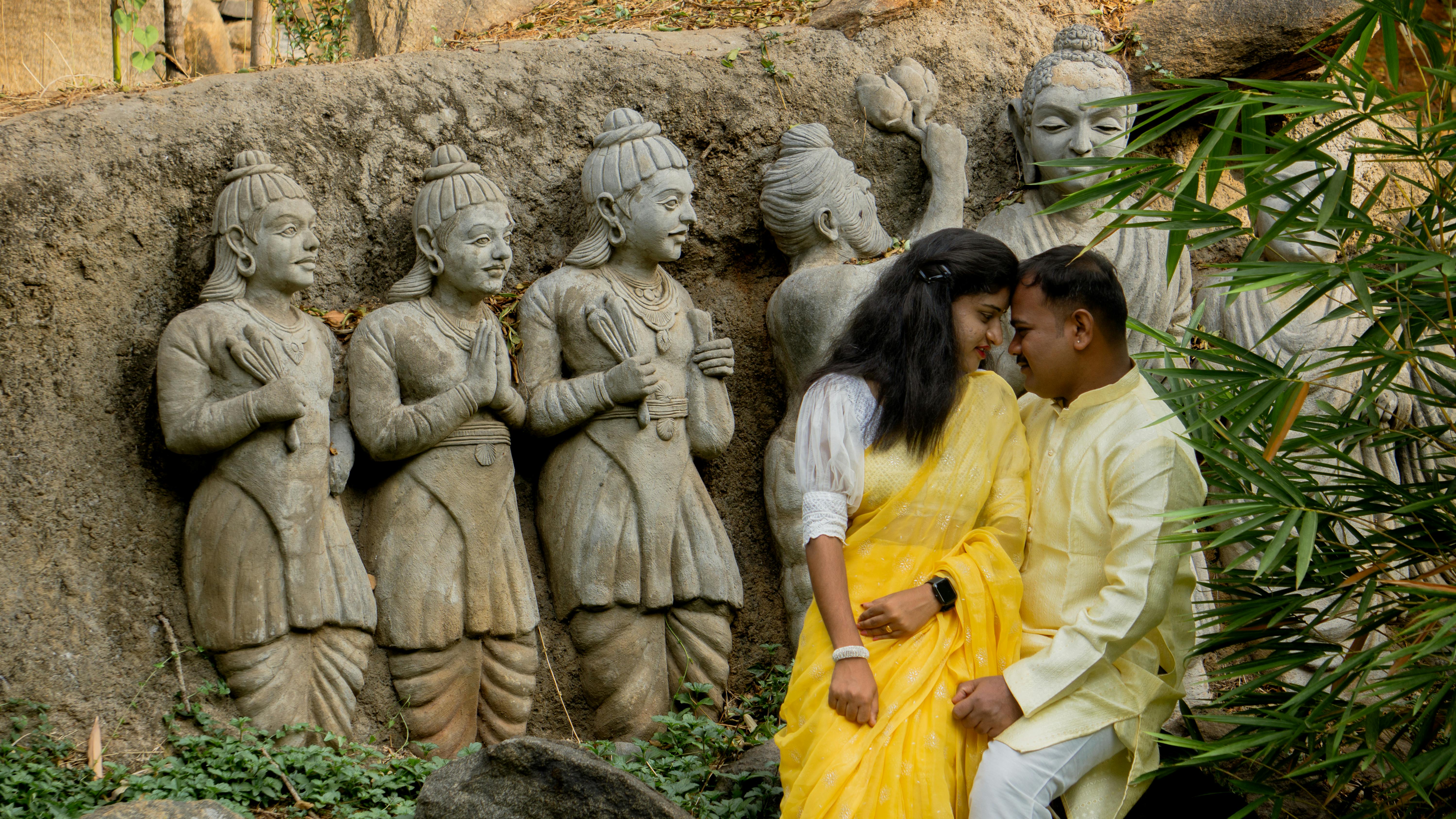 Romantic Couple by Ancient Stone Sculptures · Free Stock Photo