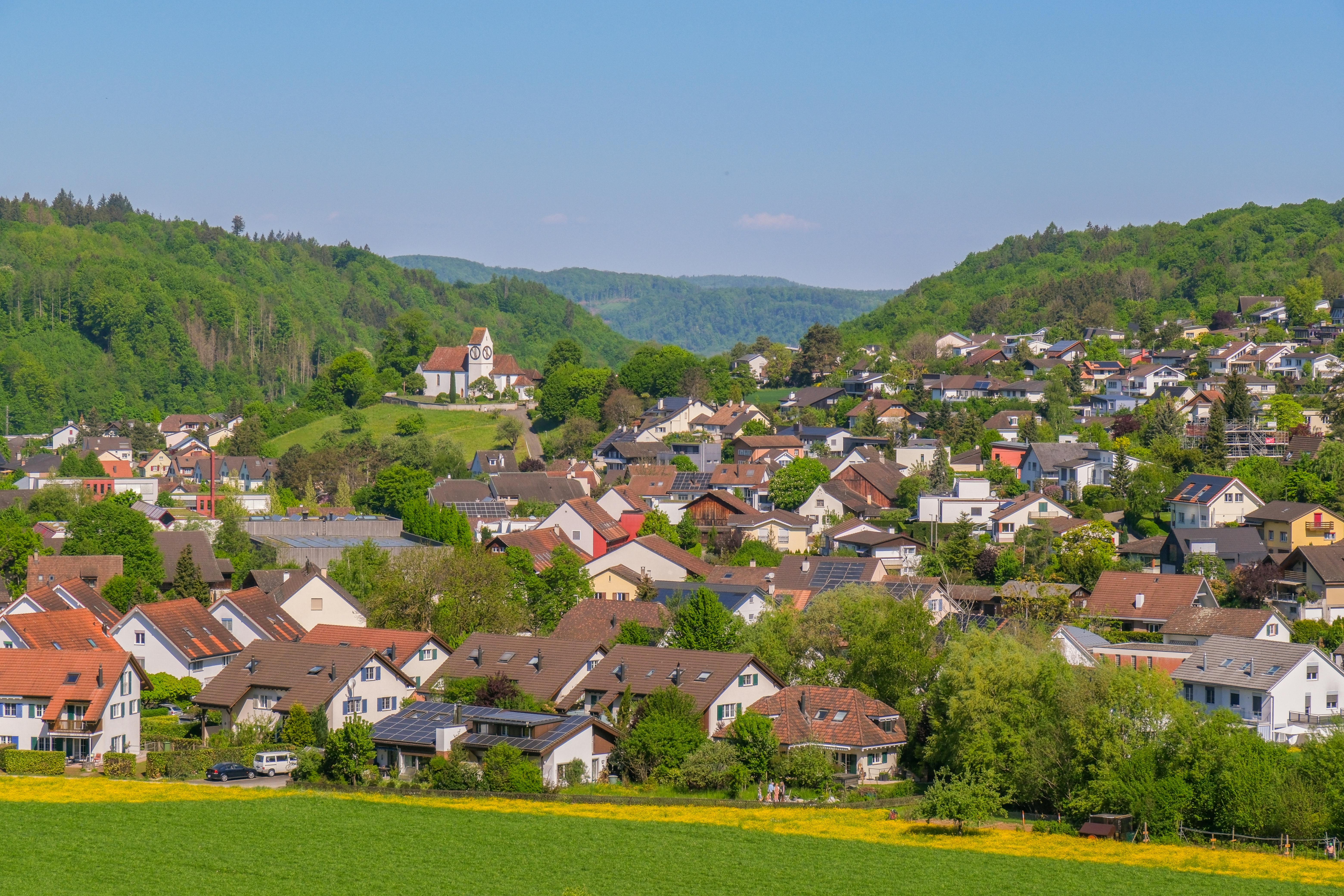 Idyllic European Village with Scenic Hills in Spring · Free Stock Photo