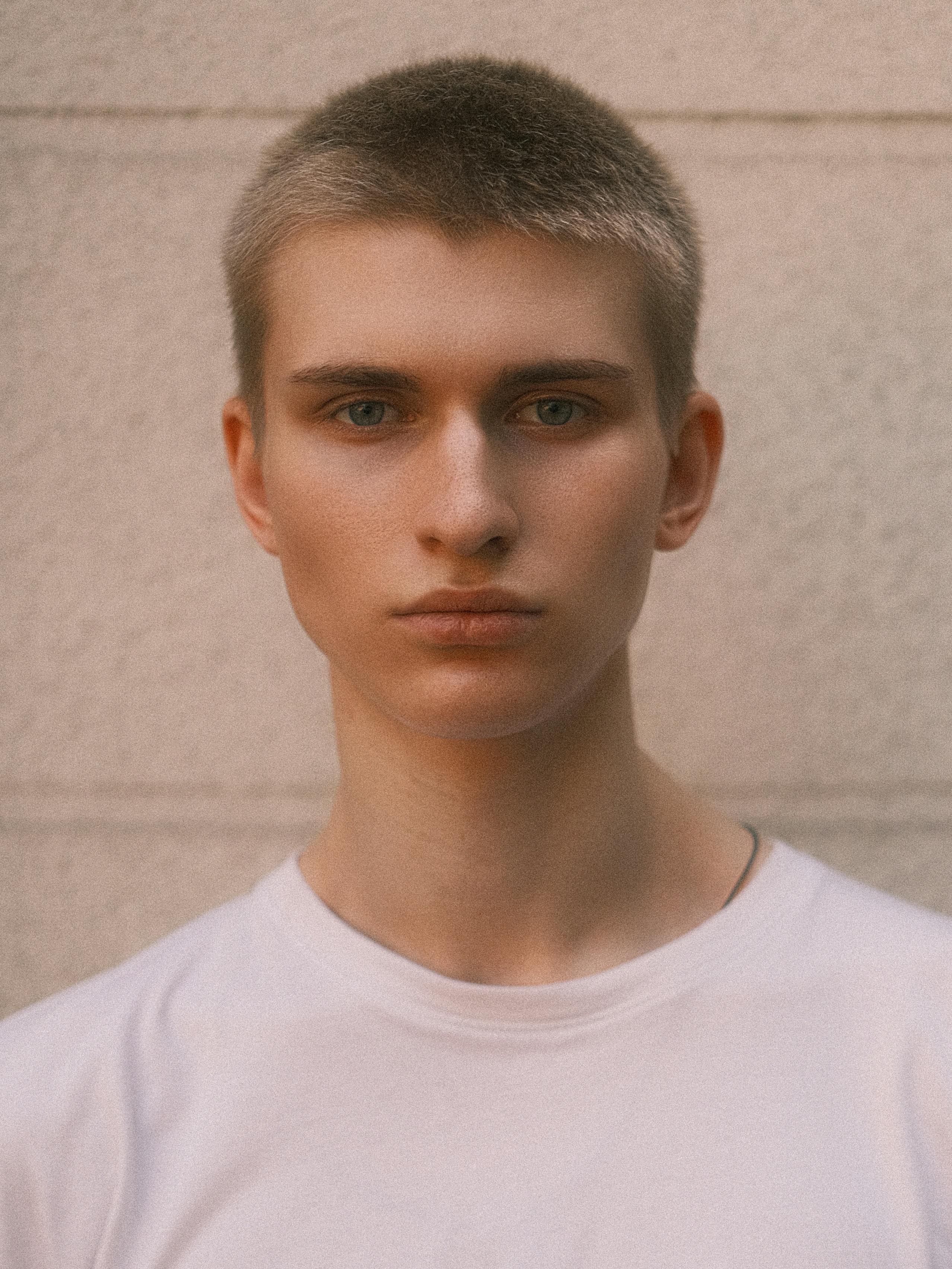 Minimalist Portrait of Young Adult in White Shirt · Free Stock Photo