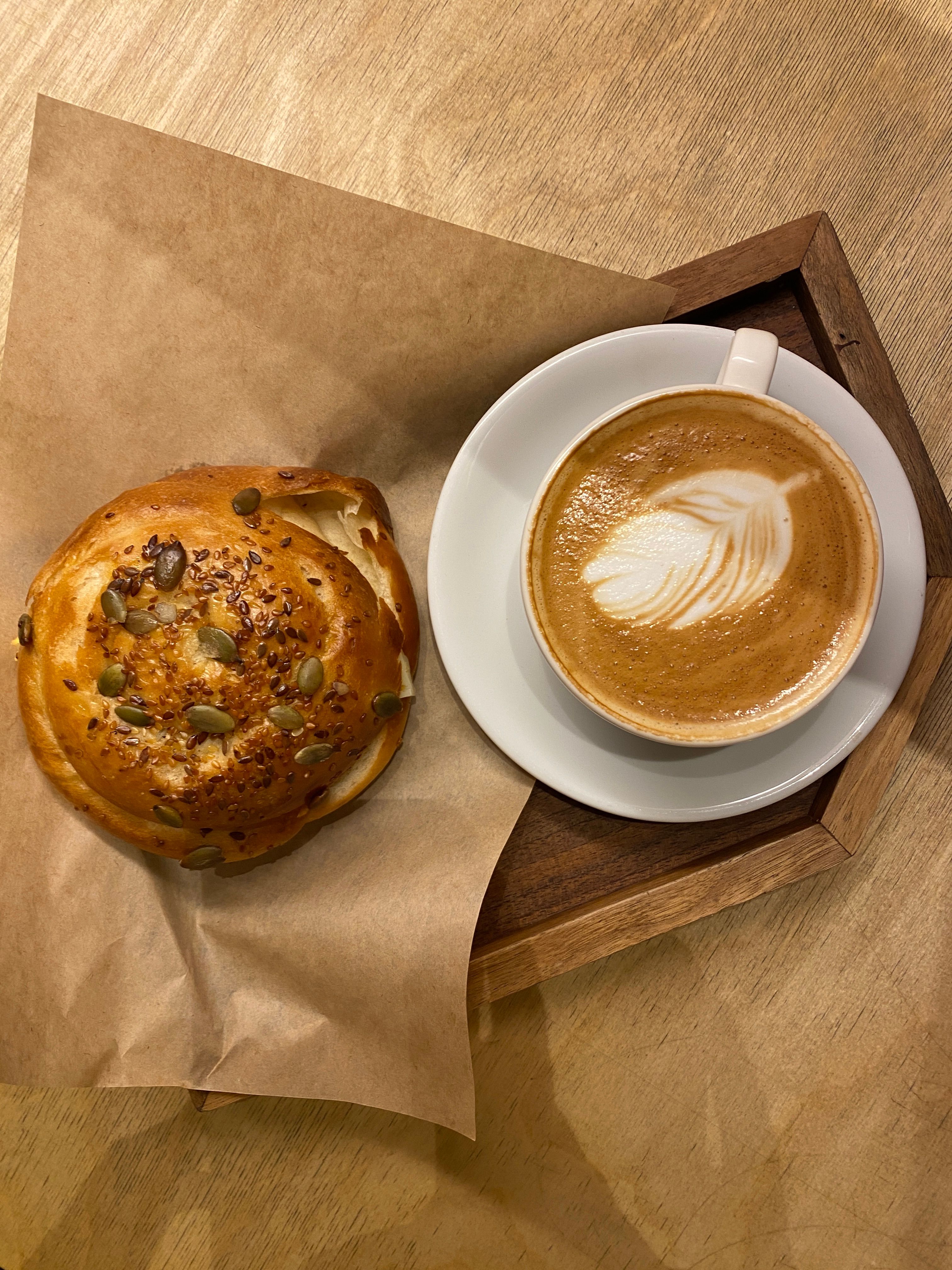 Artistic Coffee and Bun on Wooden Tray · Free Stock Photo