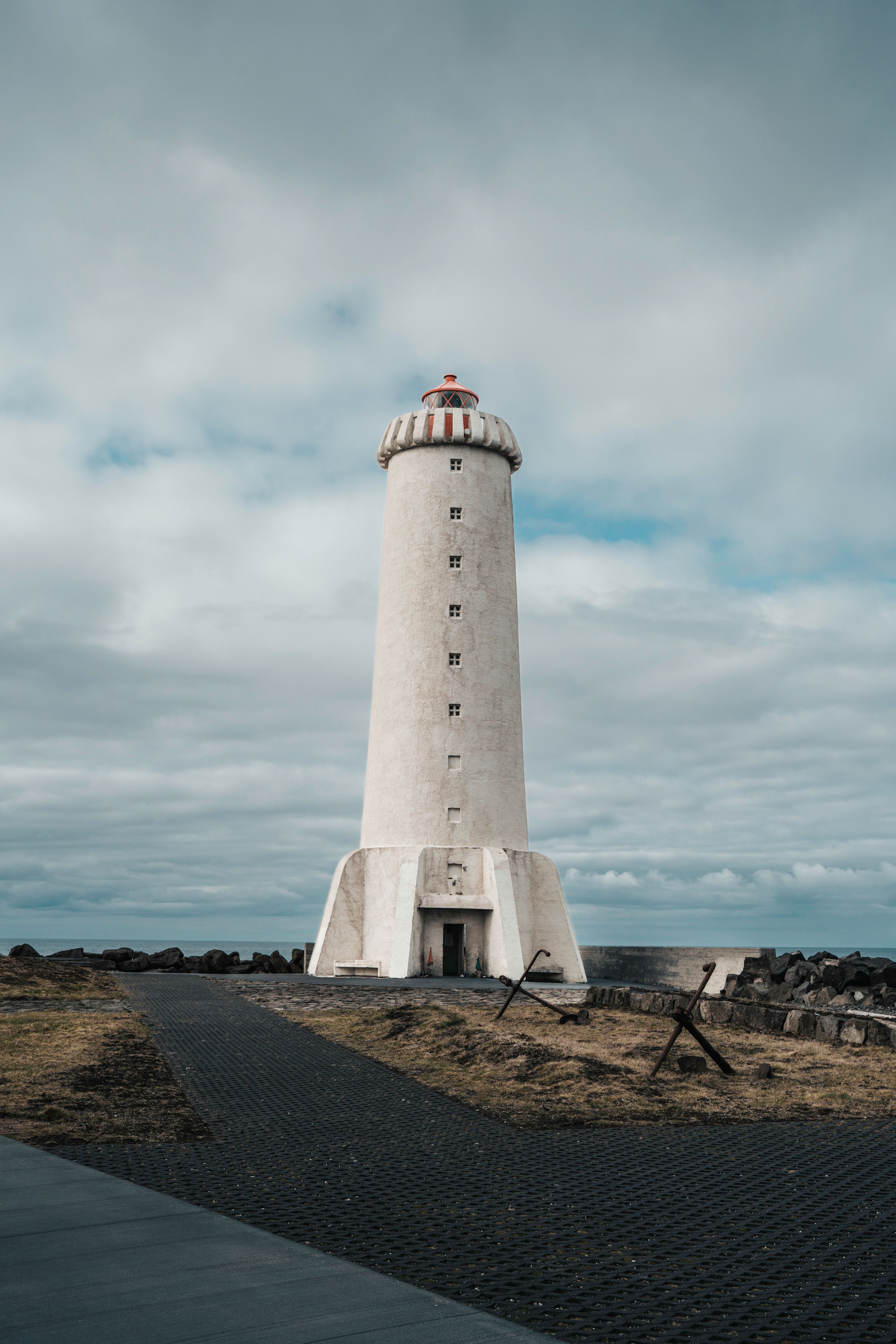 Stunning Icelandic Lighthouse Against Dramatic Sky · Free Stock Photo