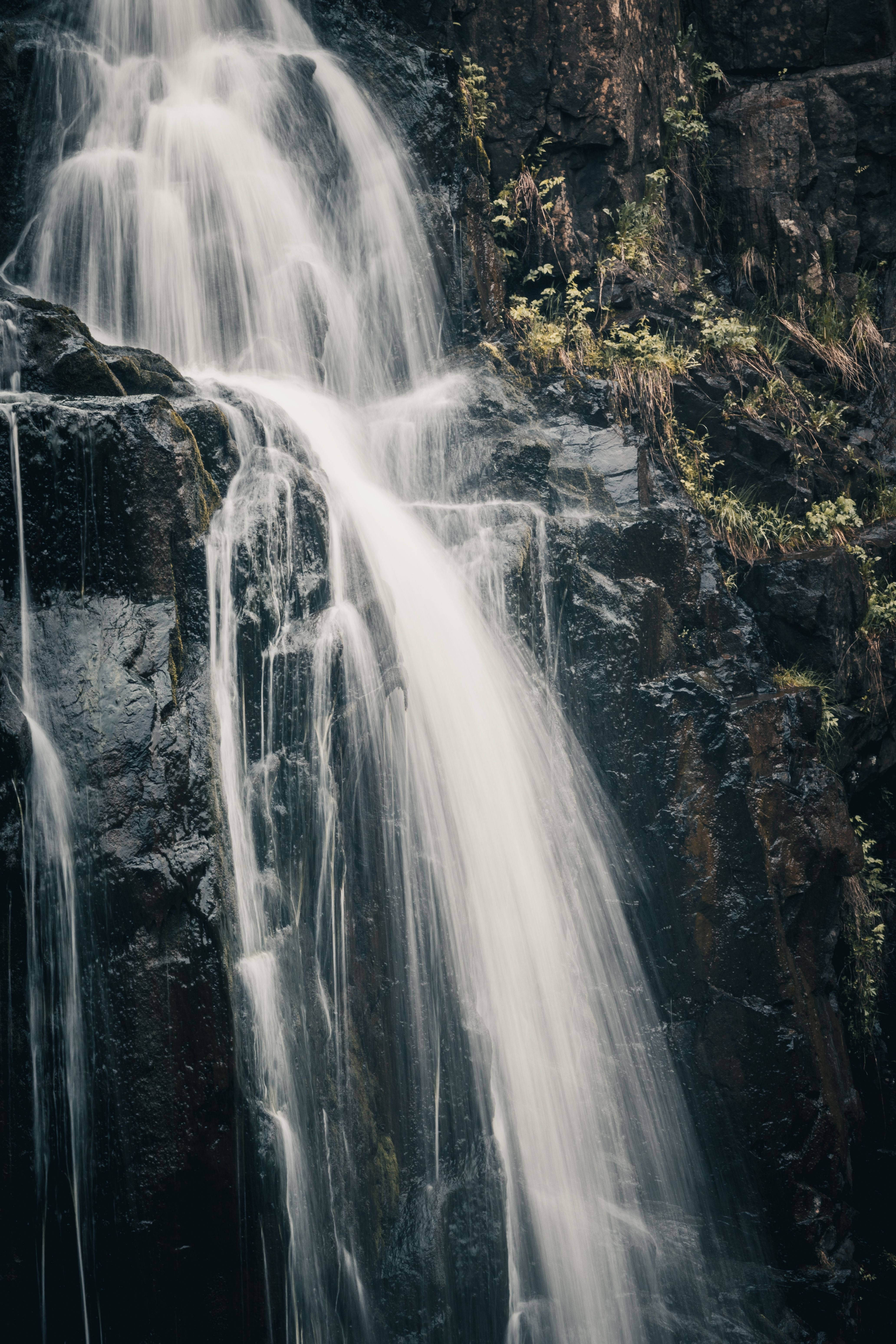 Captivating Waterfall Flowing Over Rocky Cliff Face · Free Stock Photo