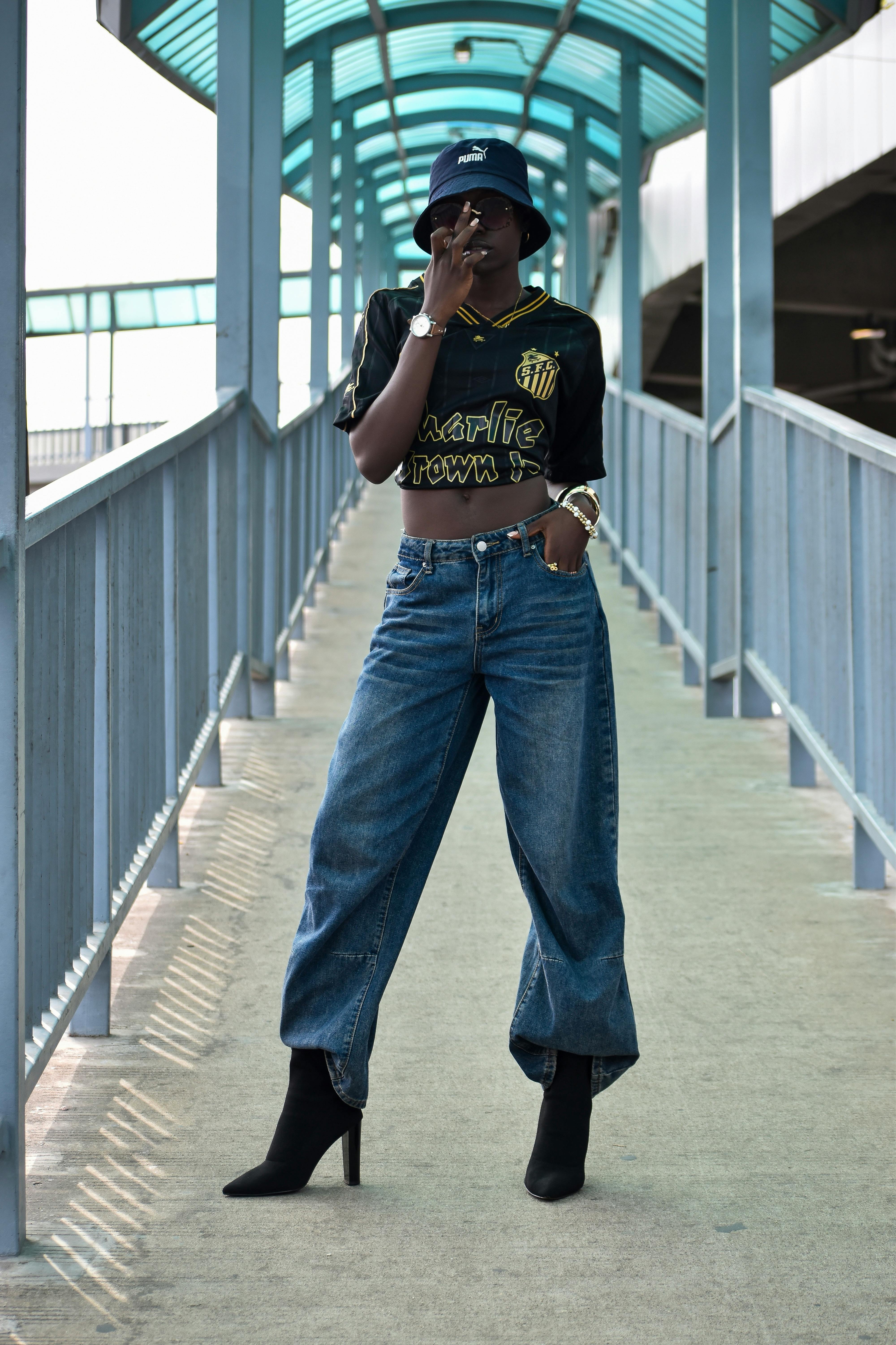 Fashionable Woman Posing on Modern Walkway · Free Stock Photo