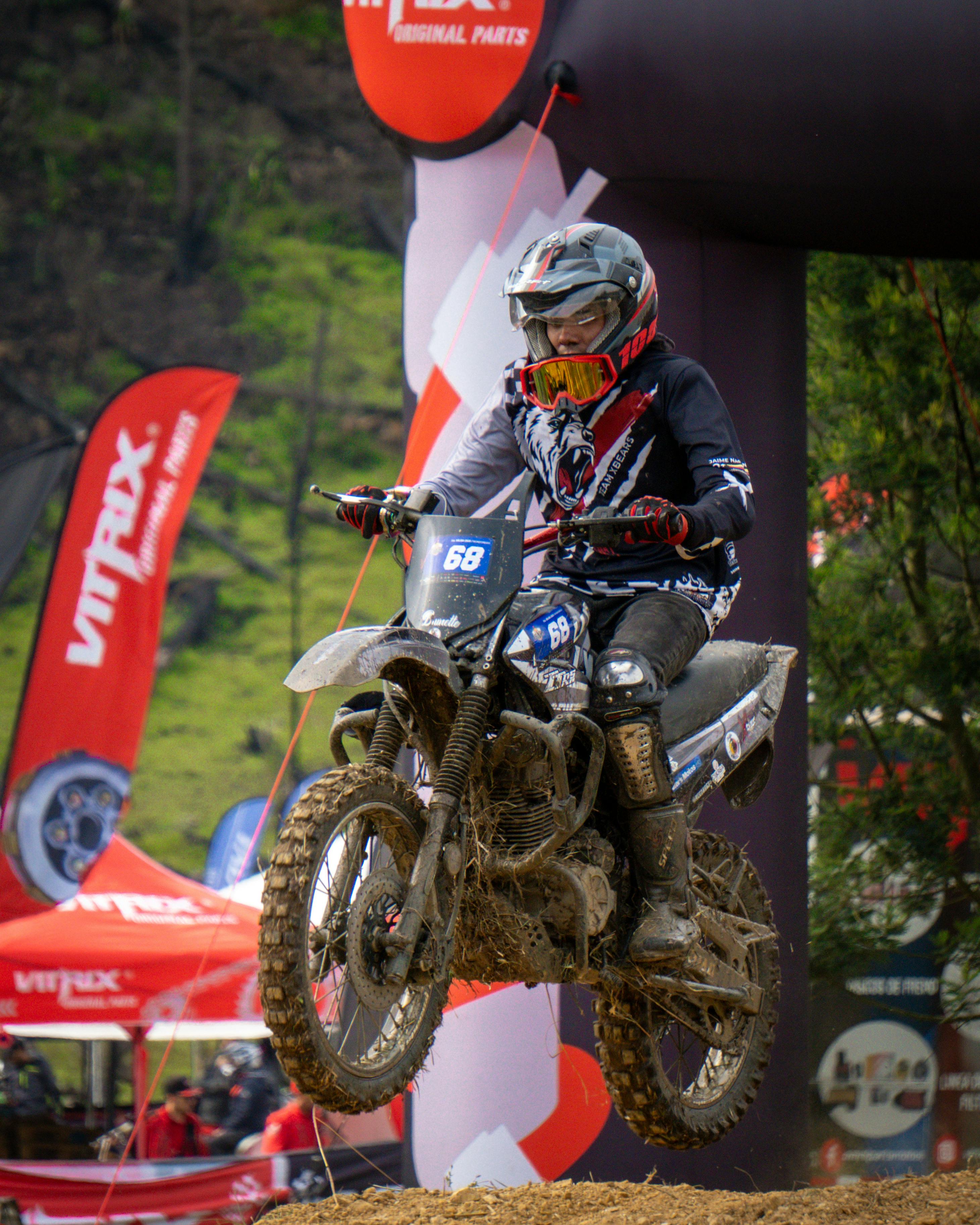 Exciting Off-Road Dirt Bike Race Action Shot · Free Stock Photo