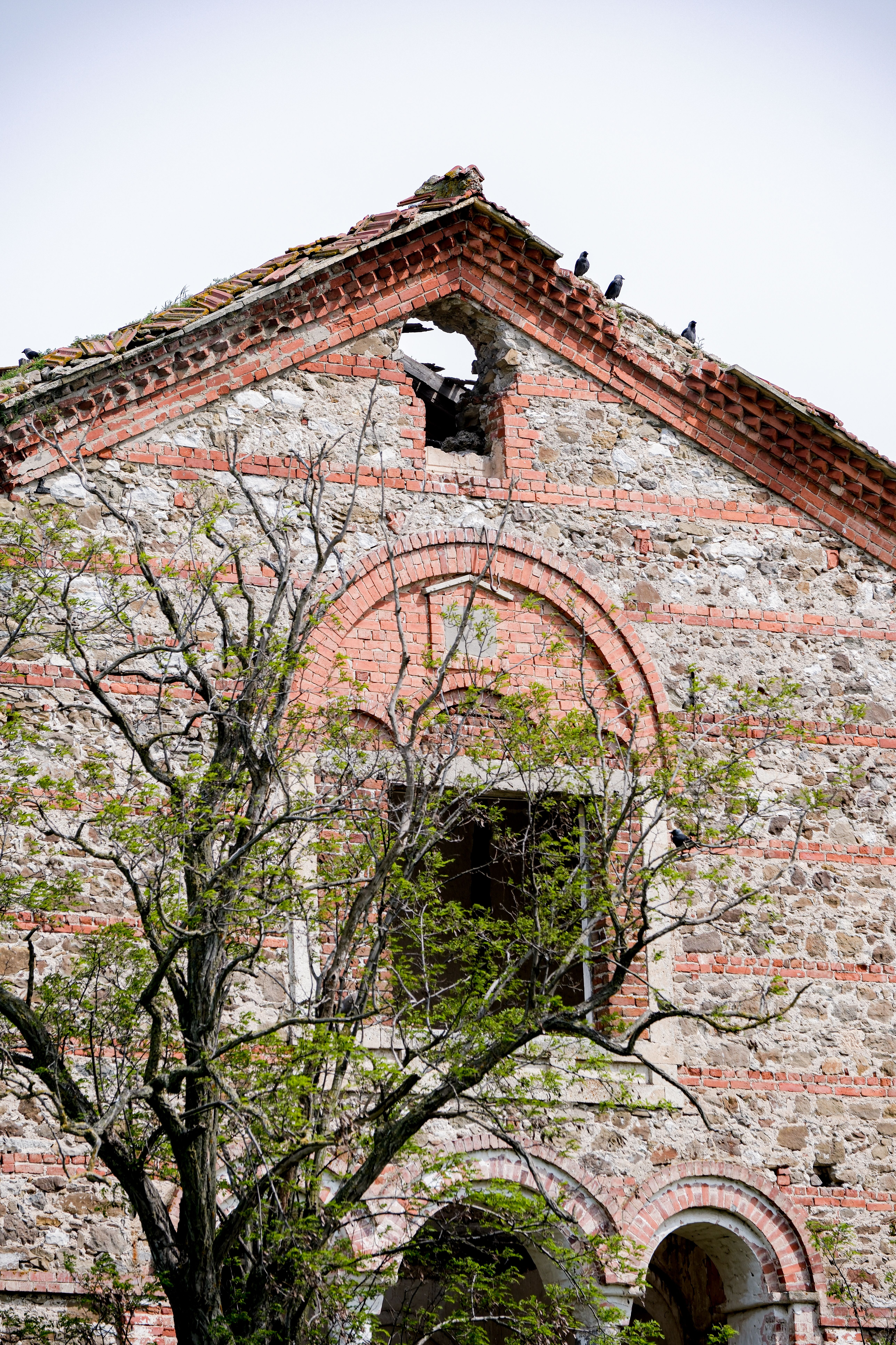 Historic Stone Church Facade with Broken Roof · Free Stock Photo