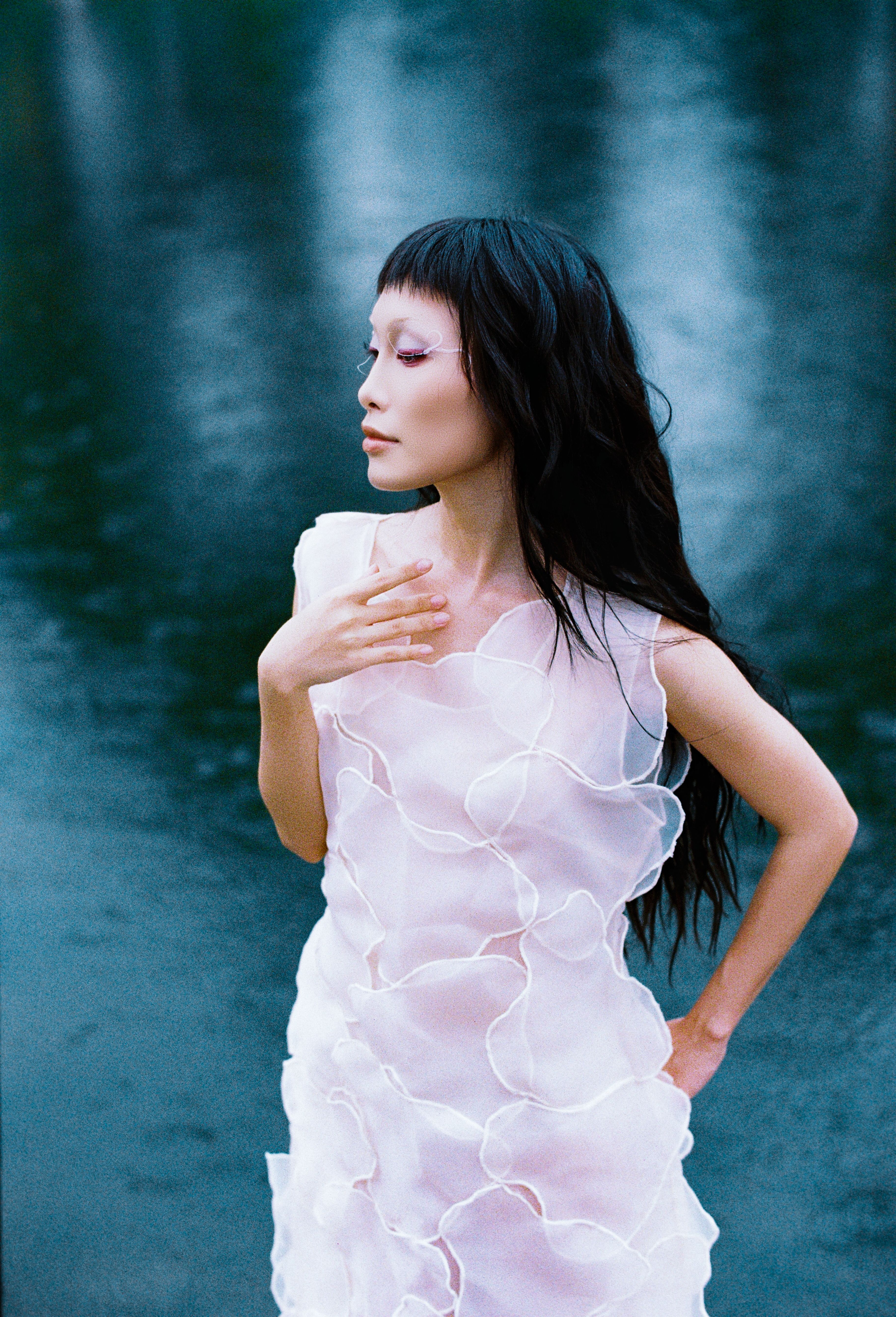 Elegant Woman in Water-Inspired Fashion Dress · Free Stock Photo