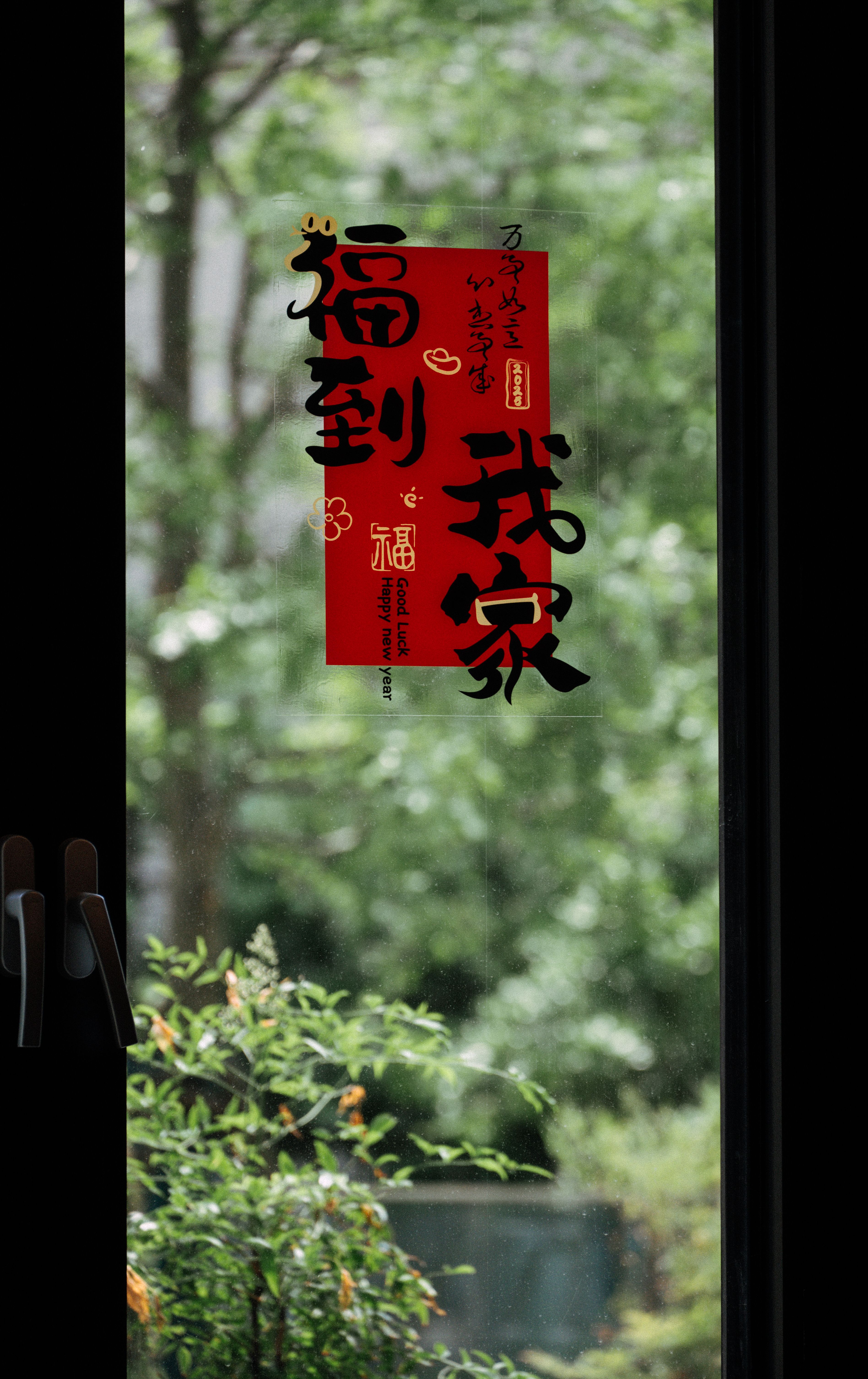 Red Chinese Calligraphy Symbol on Window · Free Stock Photo