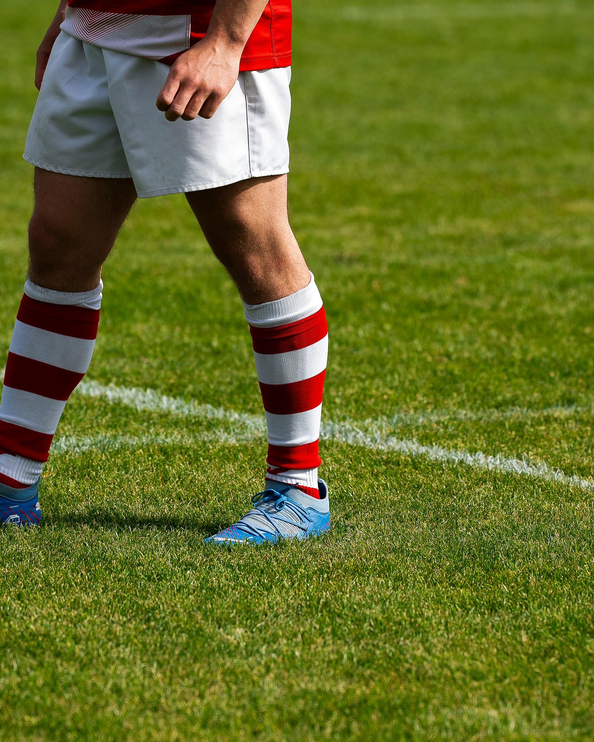 Rugby Player Standing on Field in Action Gear · Free Stock Photo