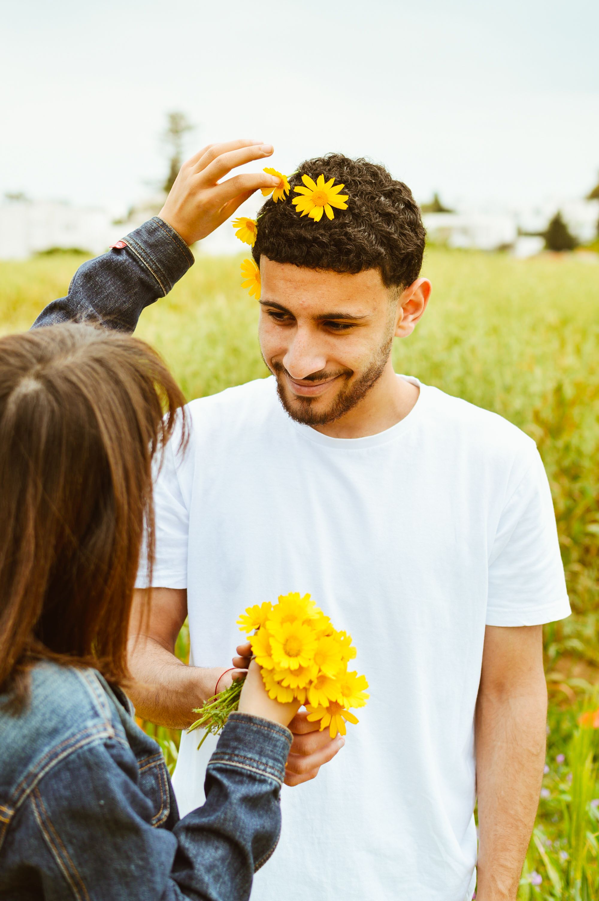 Playful Couple in a Spring Flower Field · Free Stock Photo