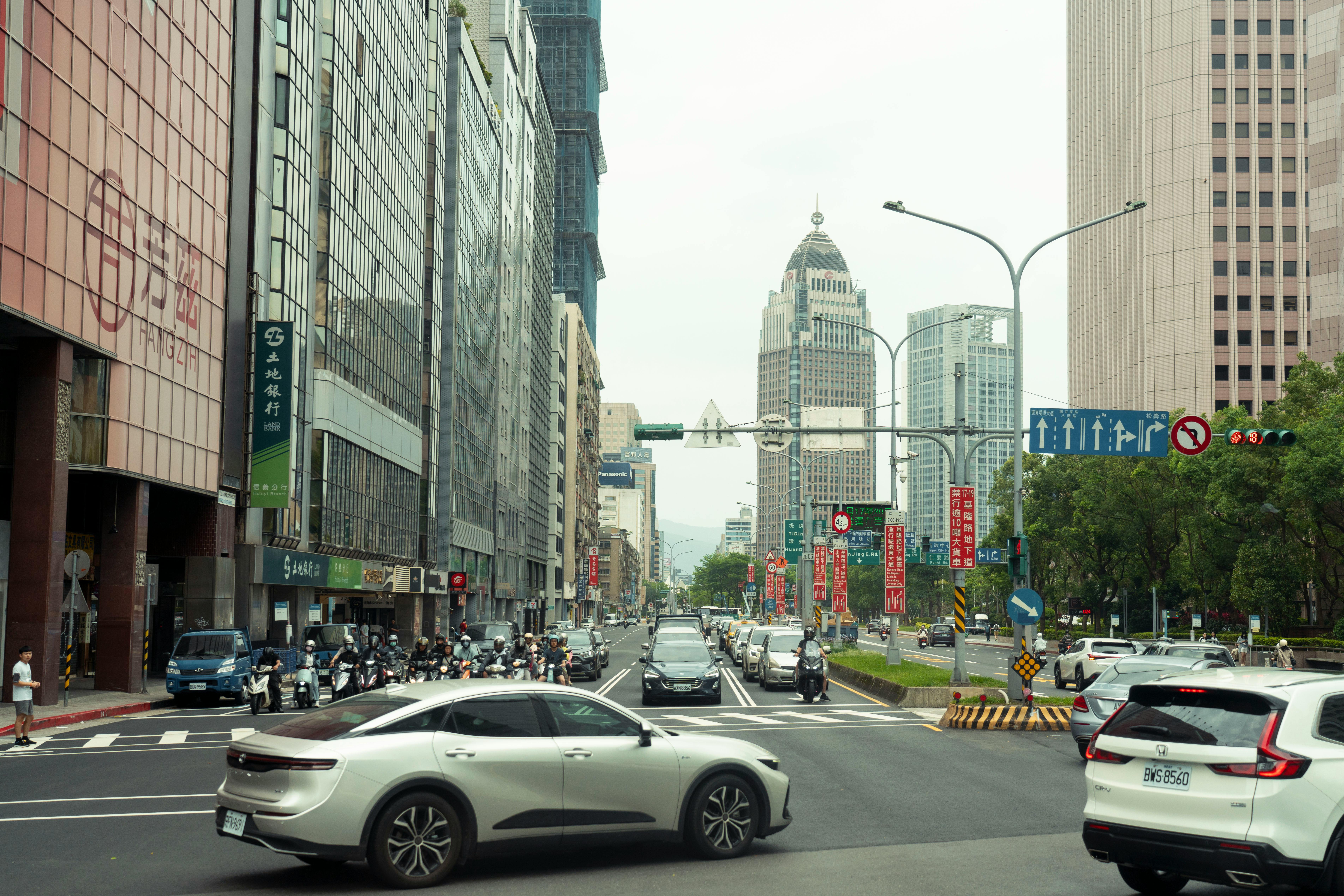 Busy Taipei Street with Traffic and High-rise Buildings · Free Stock Photo