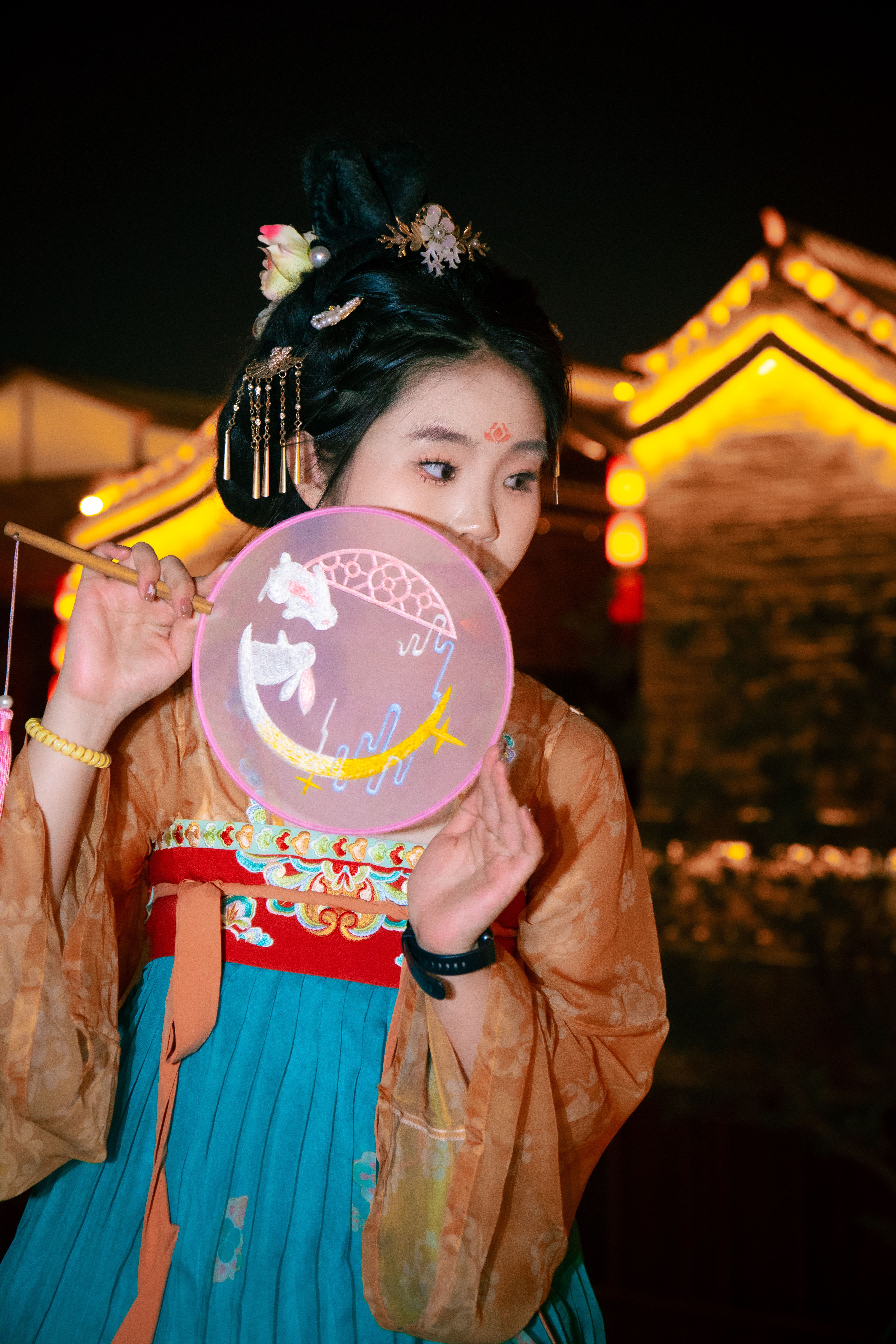 Young Woman in Traditional Hanfu Holding a Decorative Fan · Free Stock ...