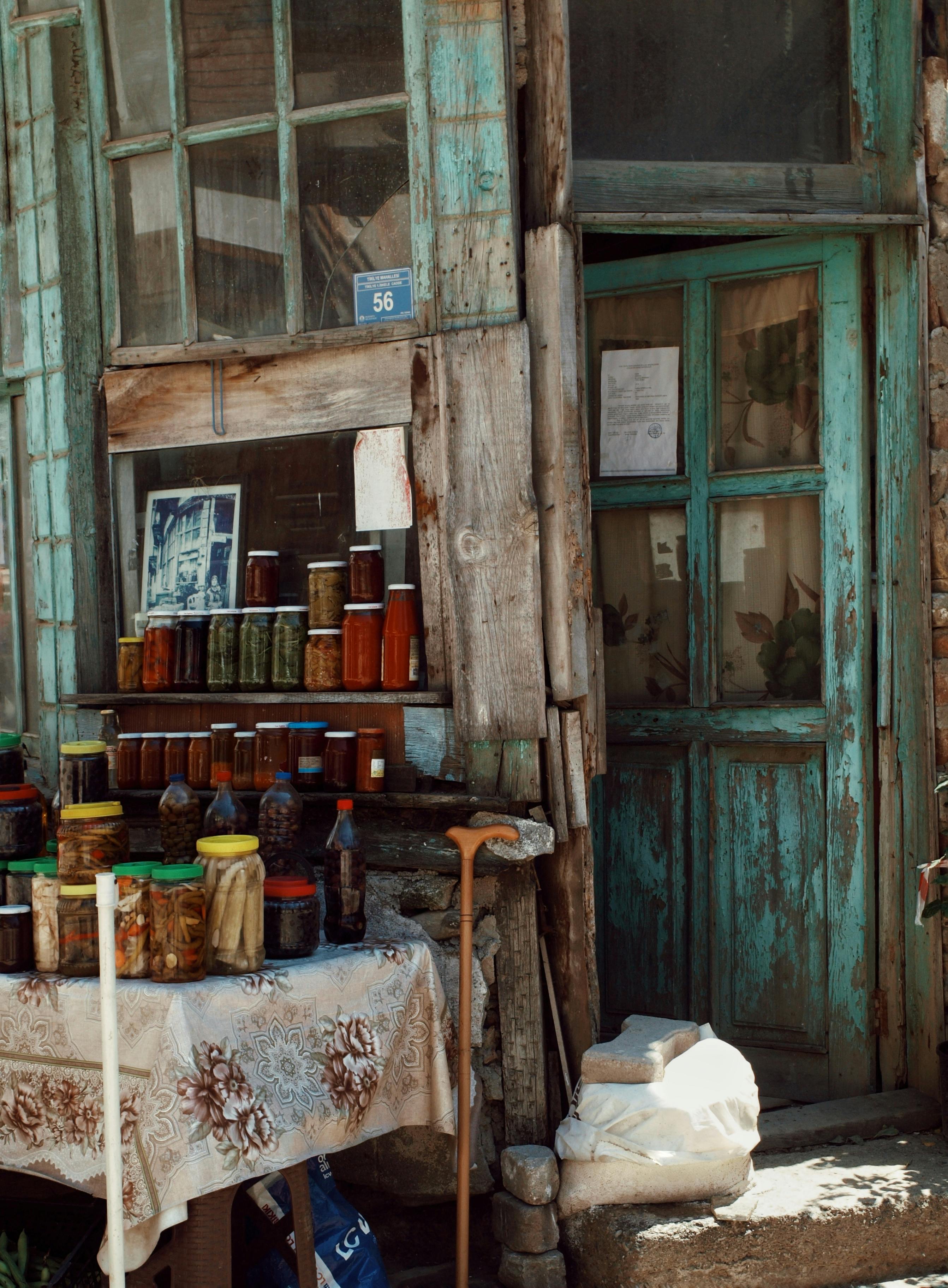 Rustic Market Stall with Preserved Goods on Display · Free Stock Photo