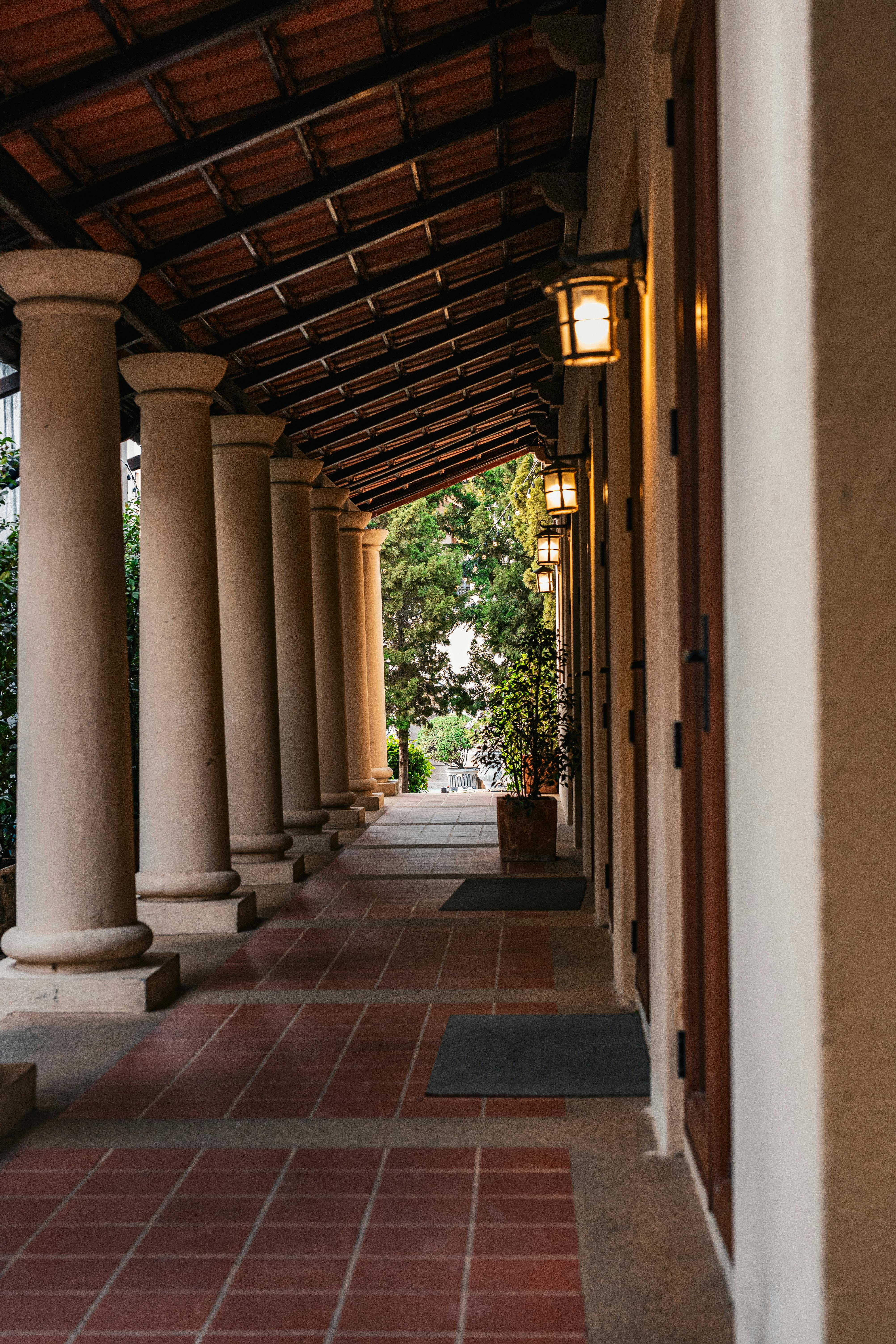 Elegant Covered Walkway with Stone Columns · Free Stock Photo