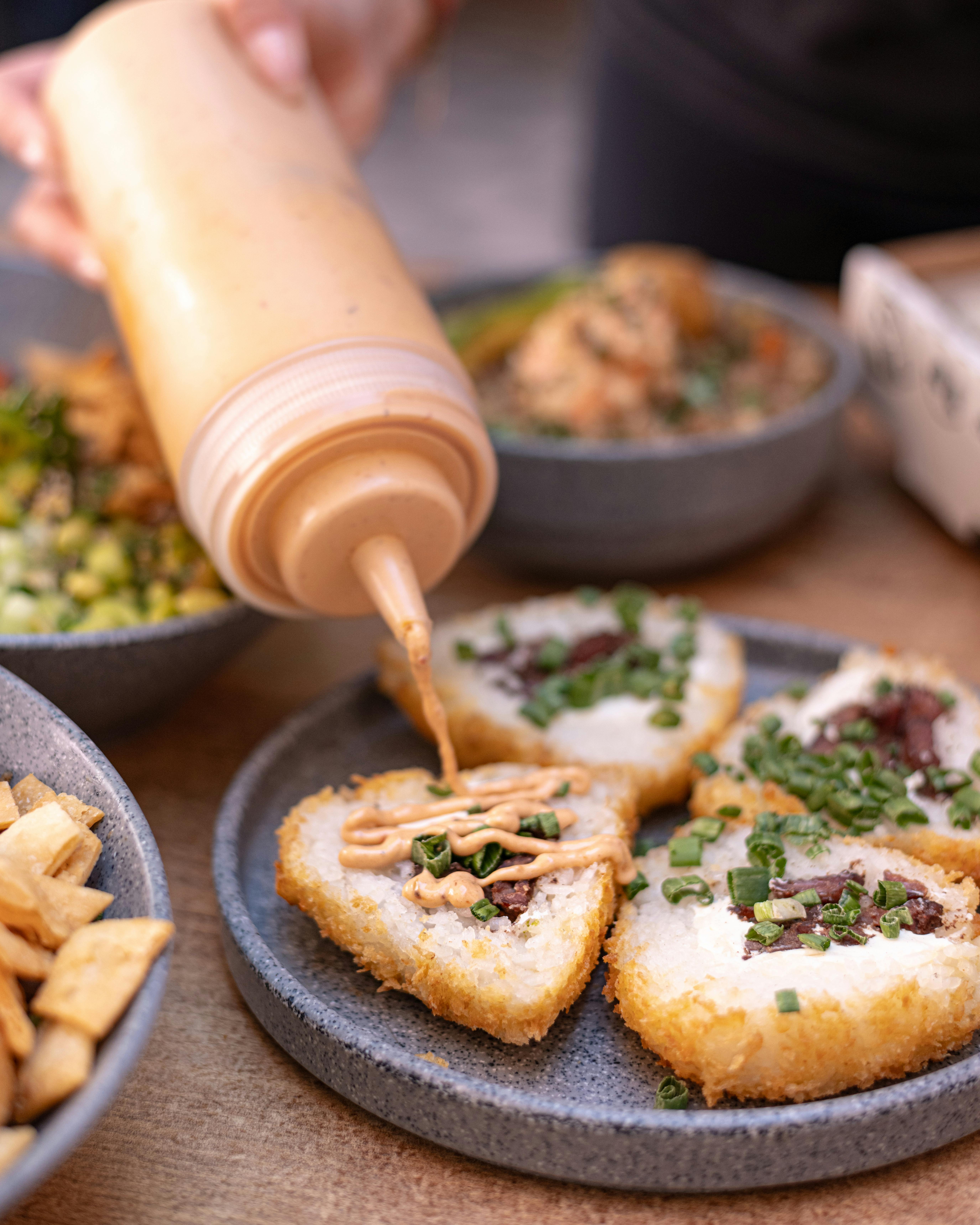 Gourmet Appetizer with Creamy Sauce Drizzle · Free Stock Photo