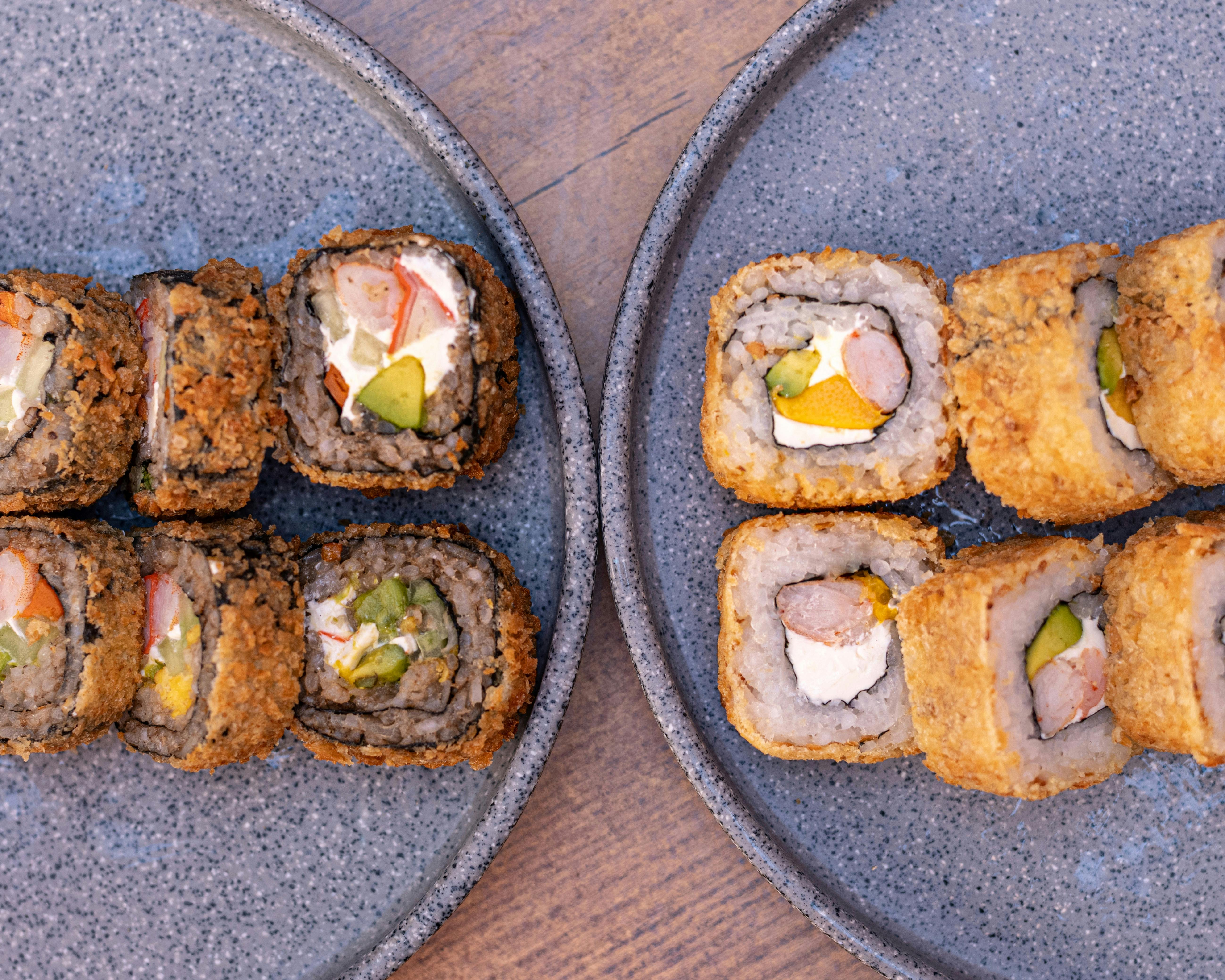 Crispy Sushi Rolls on Ceramic Plates · Free Stock Photo
