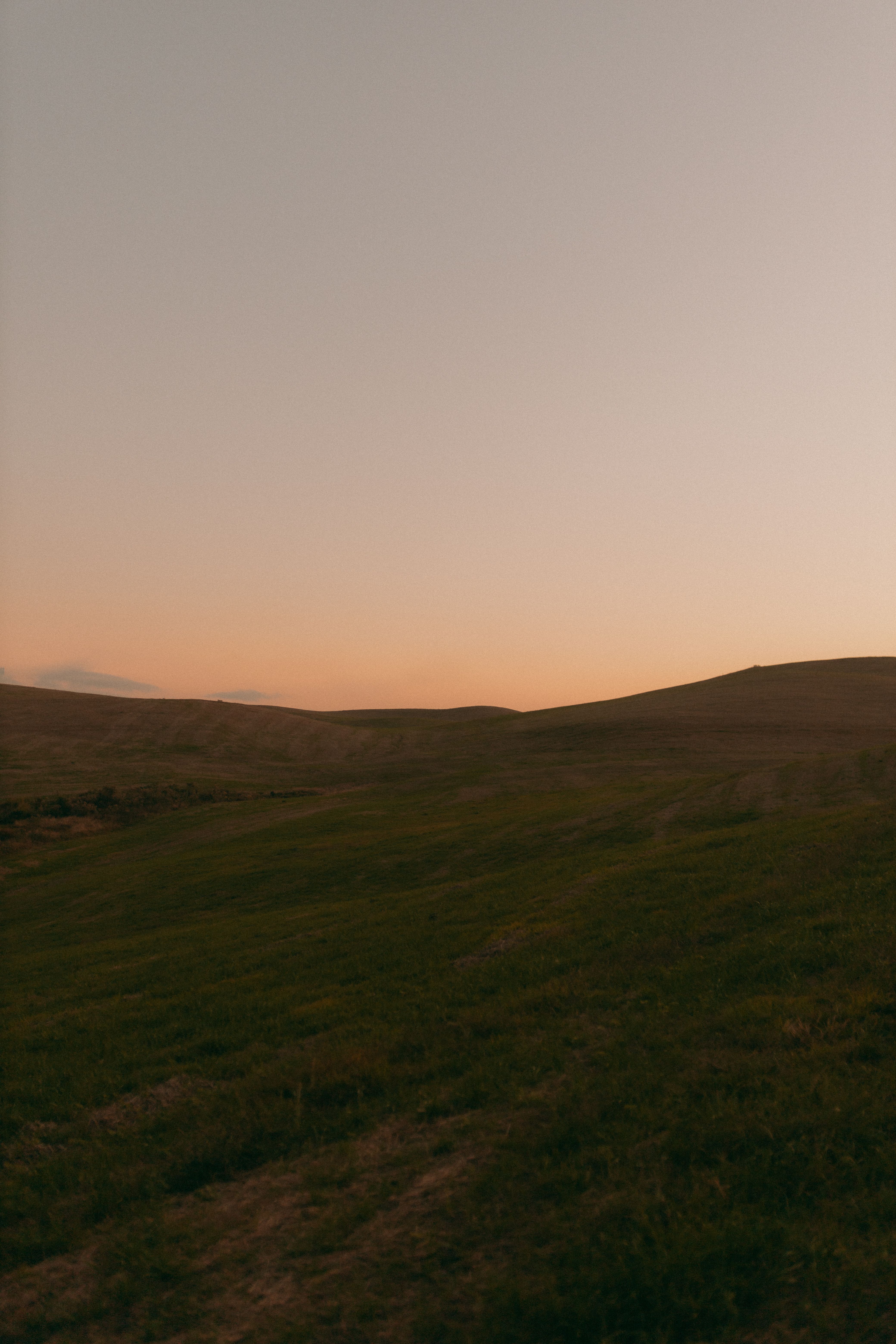 Tranquil Sunset Over Rolling Hills Landscape · Free Stock Photo
