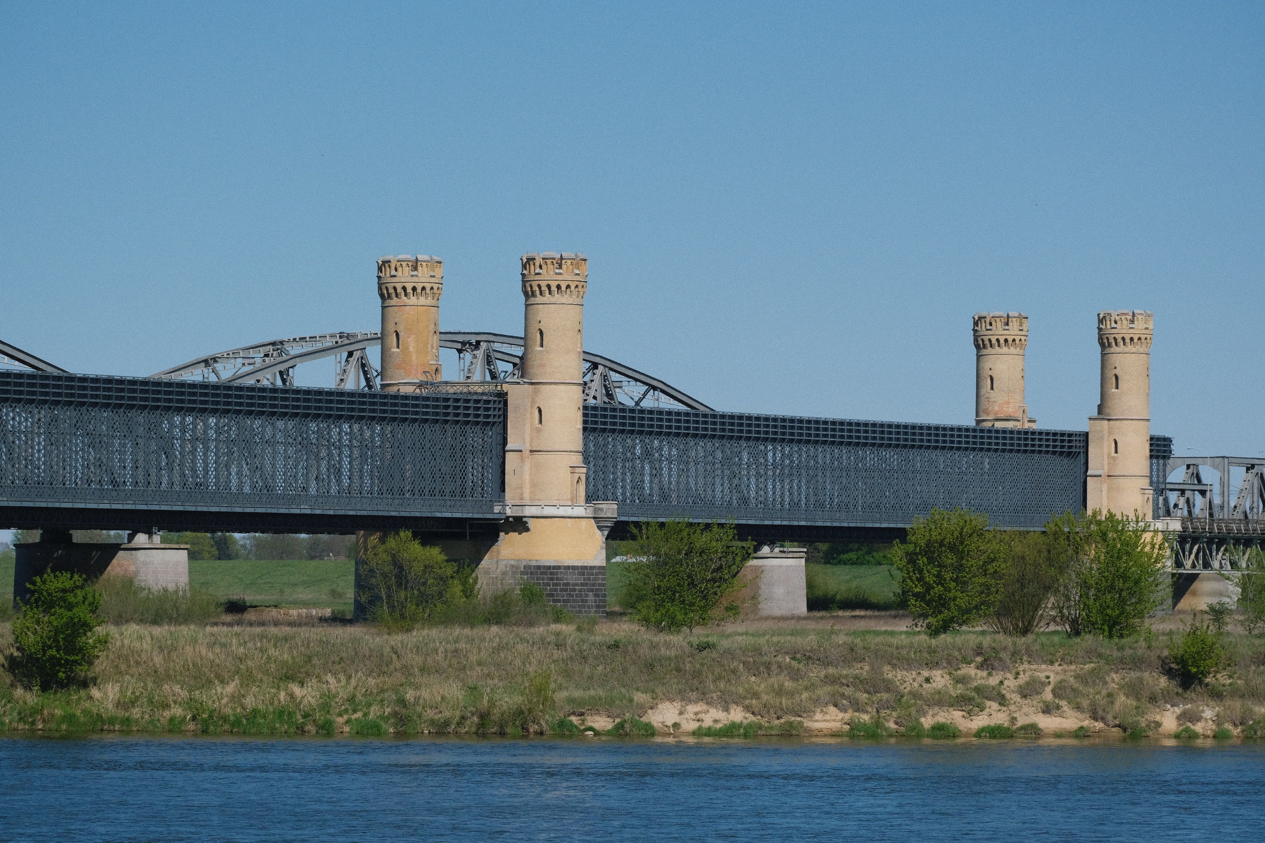 Historic Railway Bridge with Tower Structures · Free Stock Photo