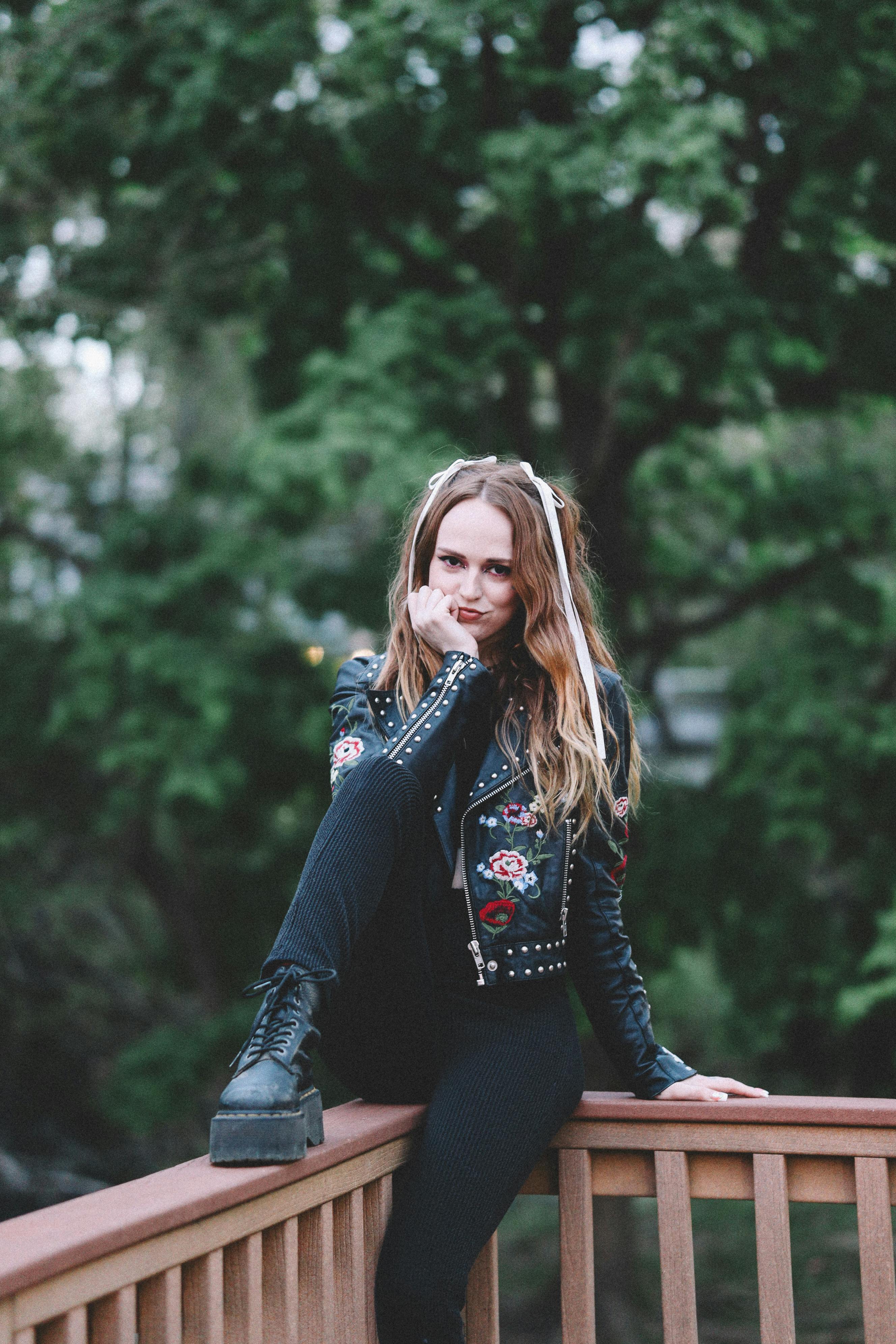 Young Woman Posing Outdoors with Edgy Style · Free Stock Photo