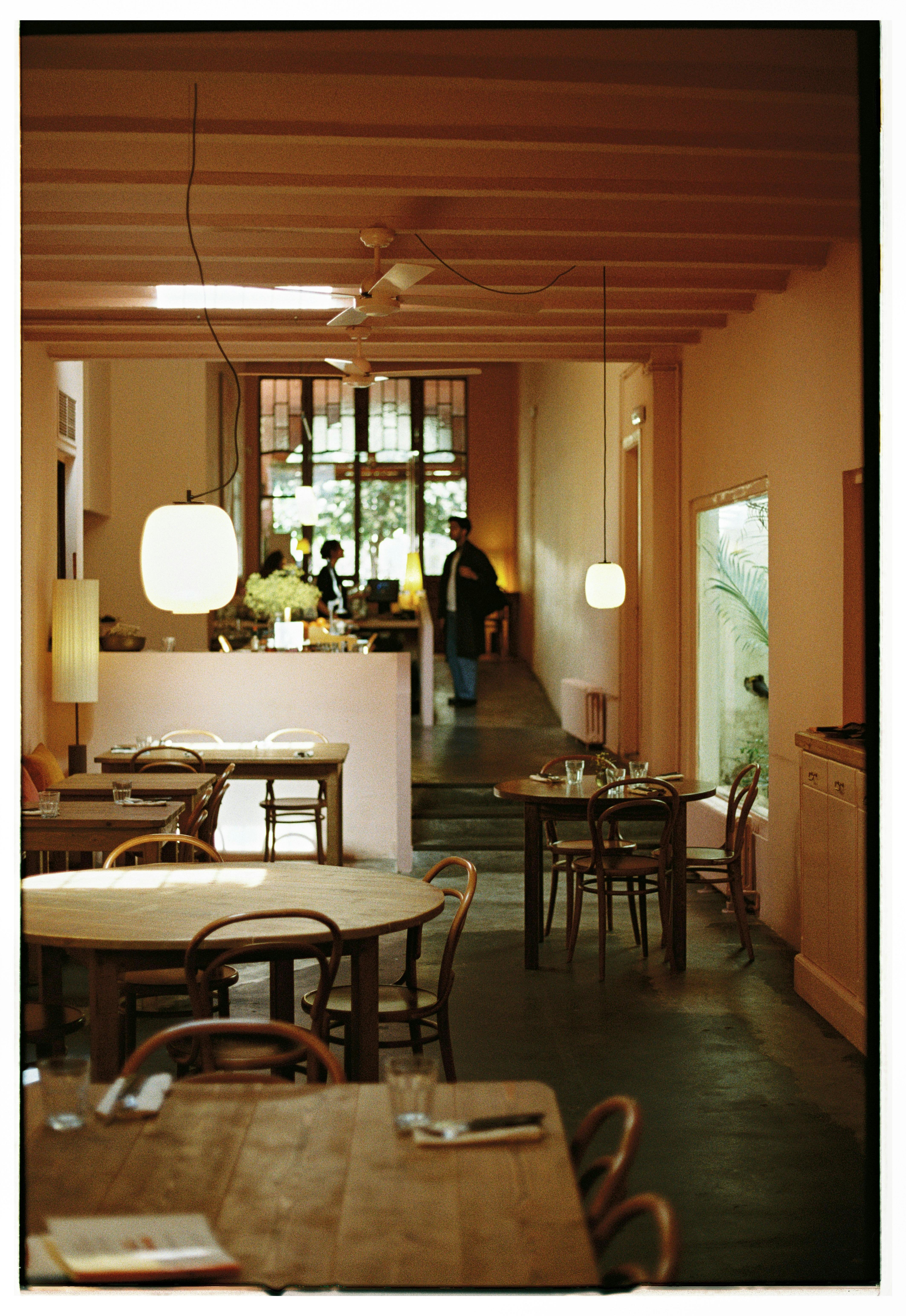 Cozy and Warm Cafe Interior with Wooden Furniture · Free Stock Photo