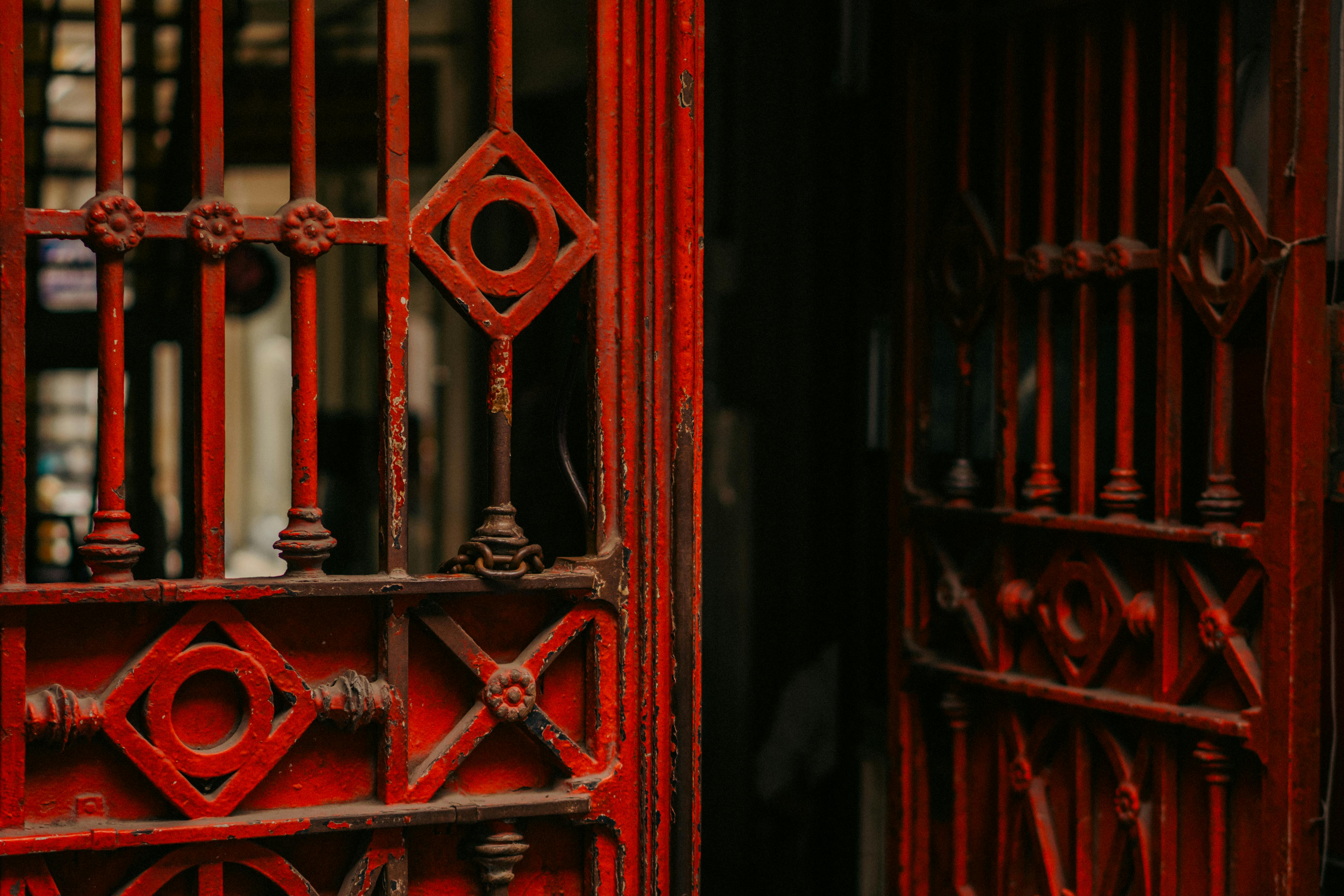 Rustic Red Iron Gate with Intricate Design · Free Stock Photo