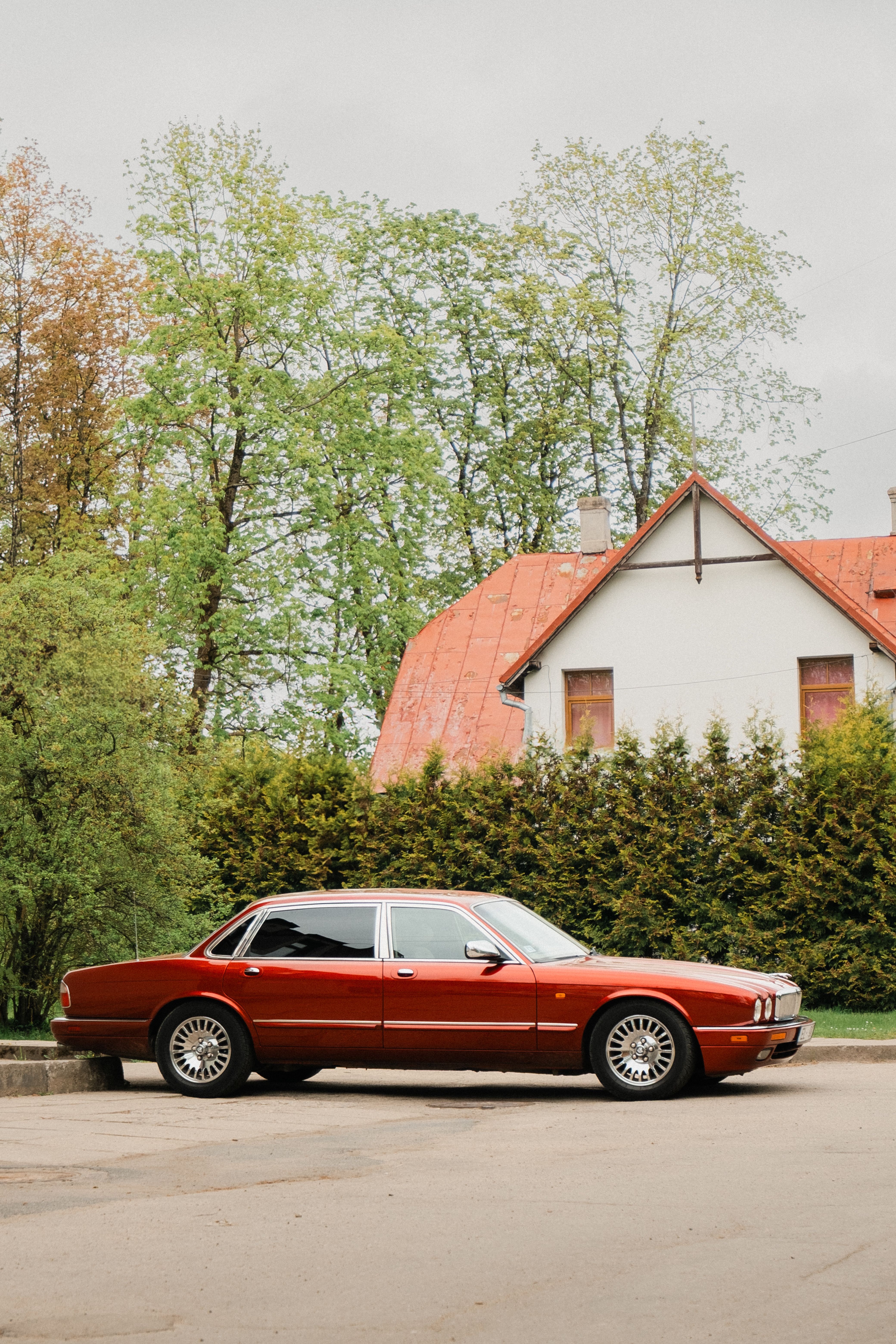 Classic Red Car Parked by Vintage House · Free Stock Photo