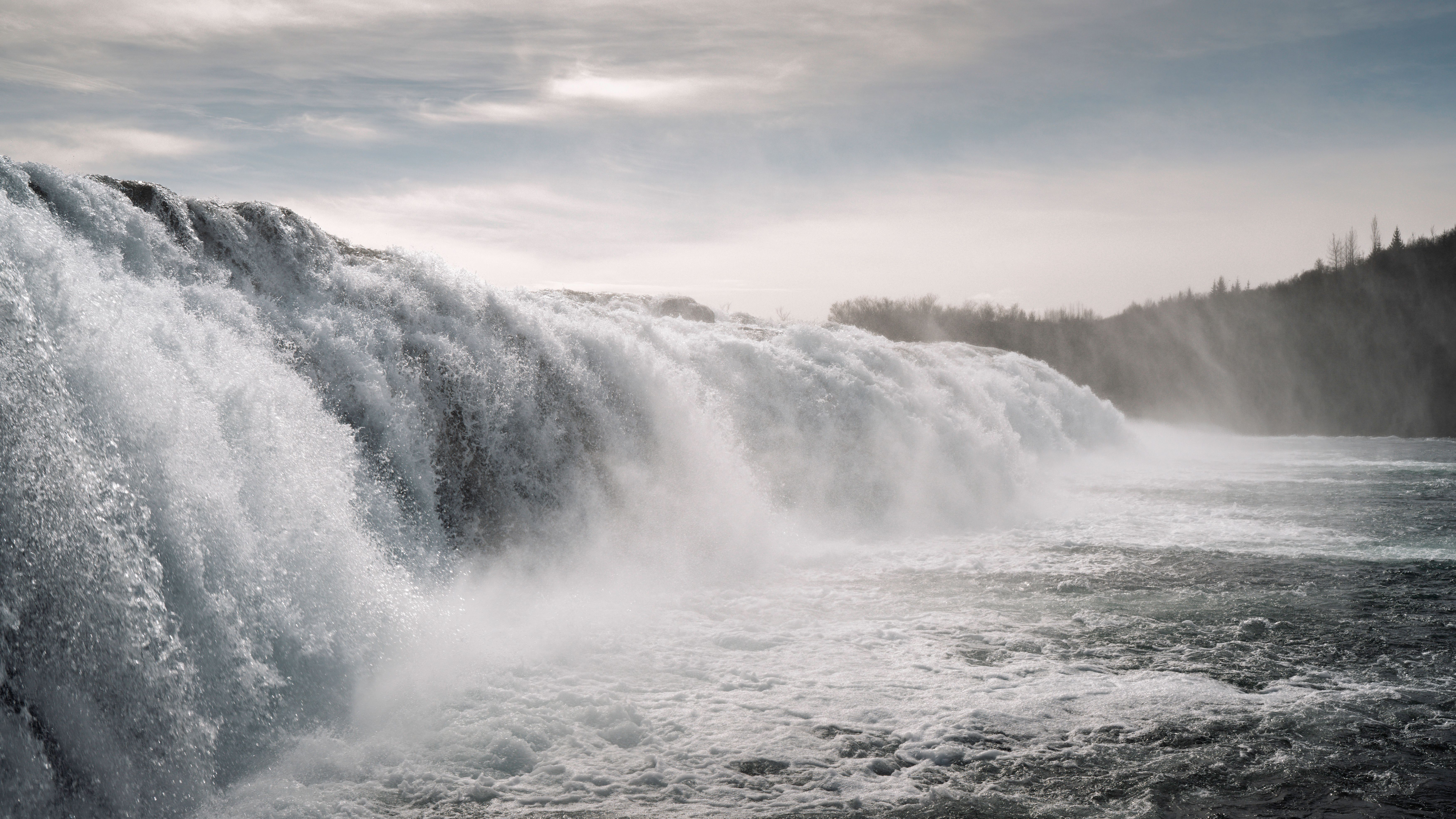Majestic Waterfall in Iceland Captured at Noon · Free Stock Photo