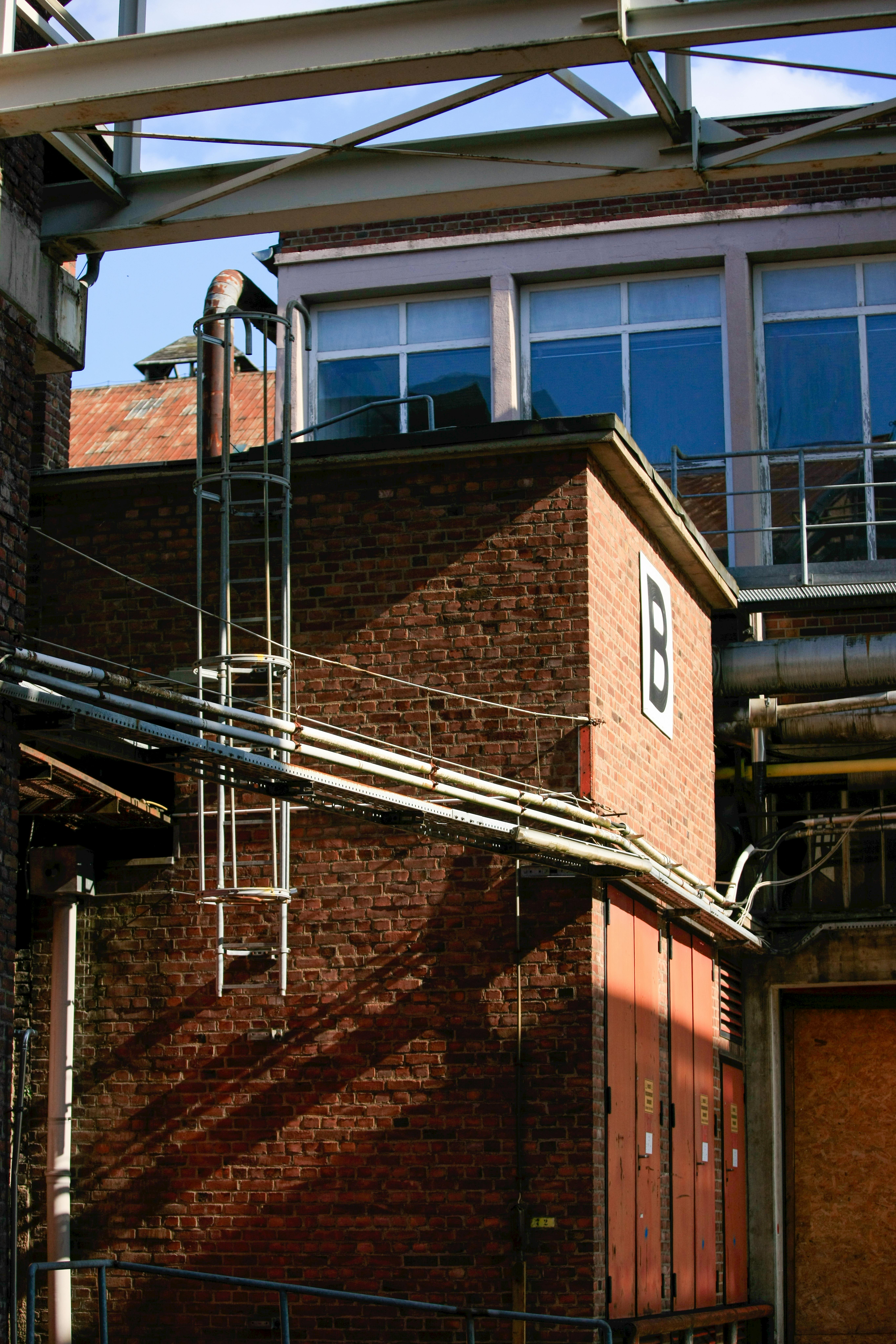 Brick Industrial Building with Metal Structures · Free Stock Photo