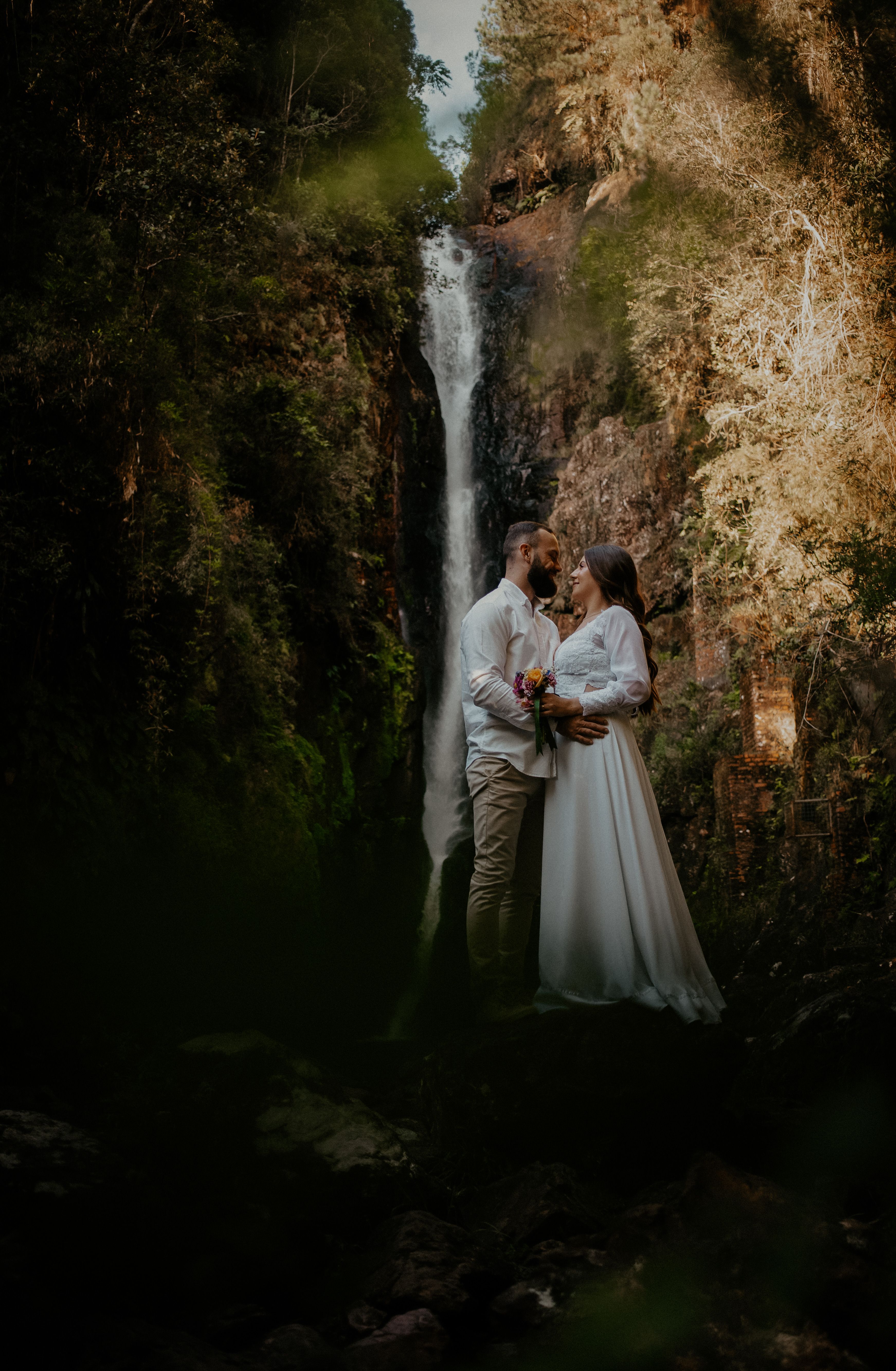 Romantic Couples Photoshoot at Scenic Waterfall · Free Stock Photo