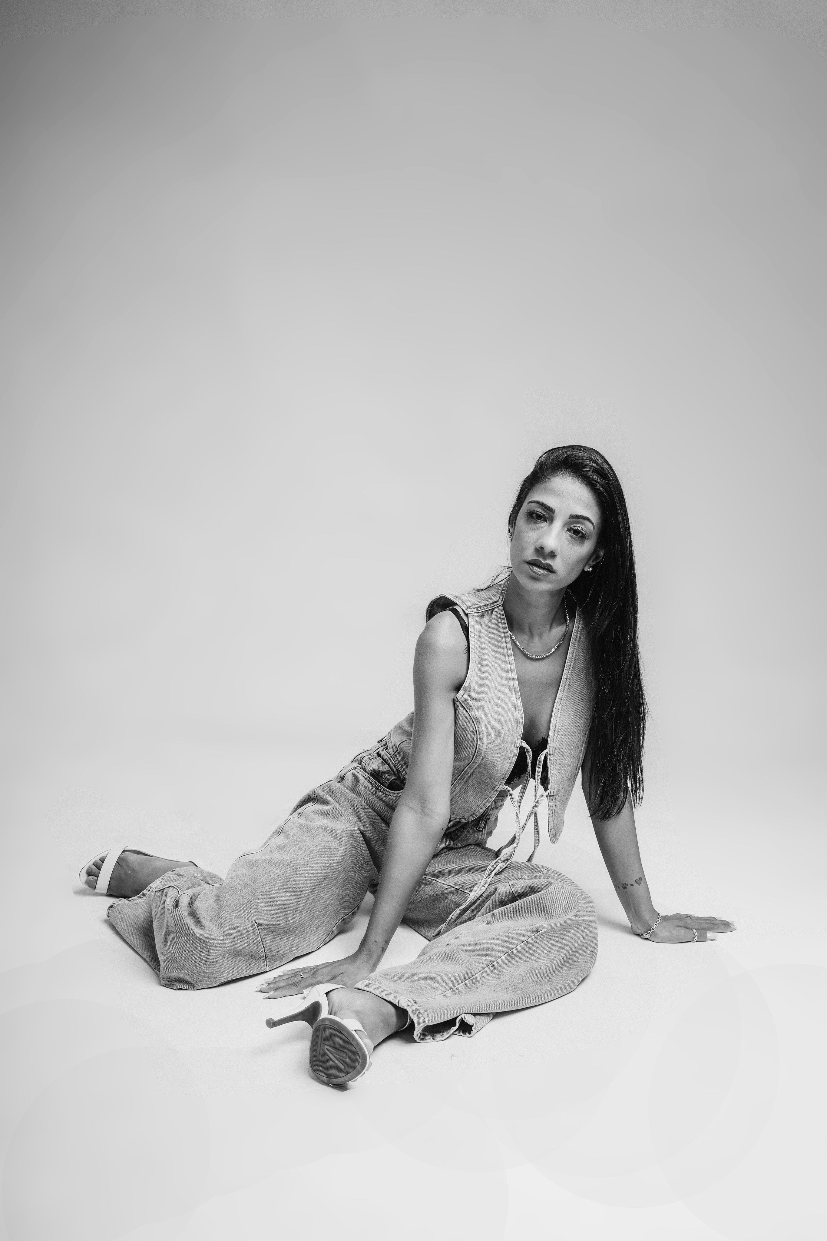 Stylish Portrait of a Woman Sitting in Studio · Free Stock Photo