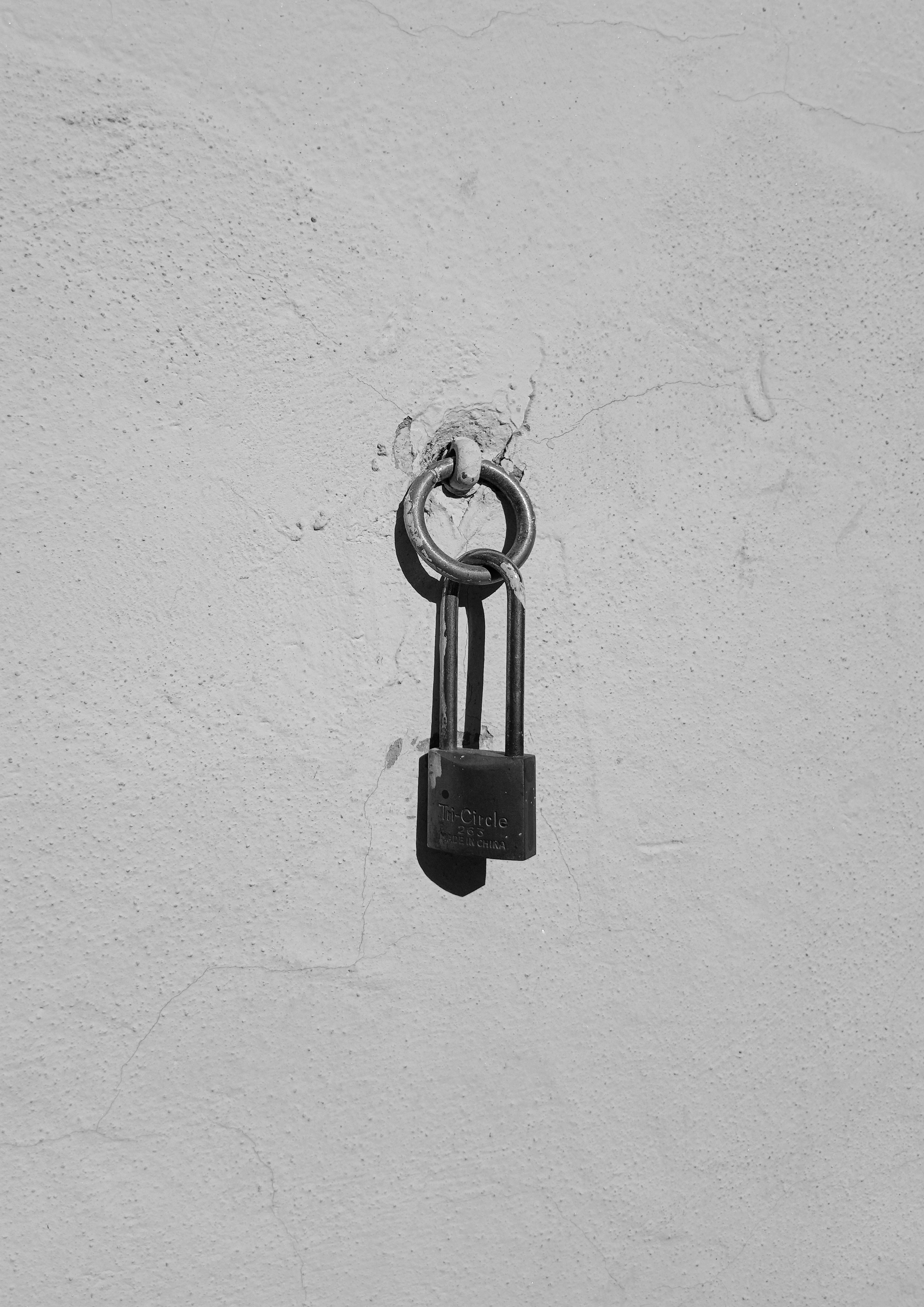 Minimalistic Black and White Padlock on Wall · Free Stock Photo