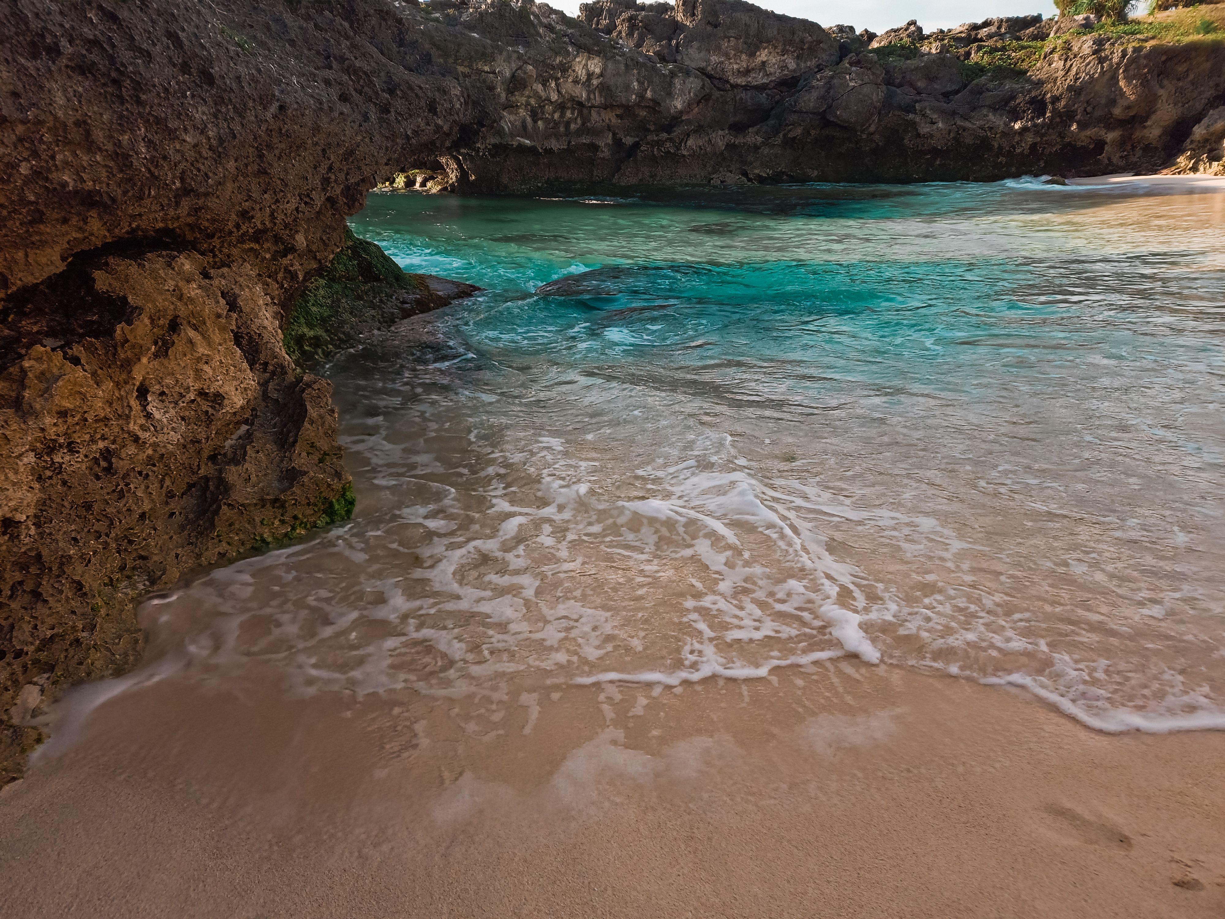 Scenic Coastal Beach with Rocky Cliffside · Free Stock Photo