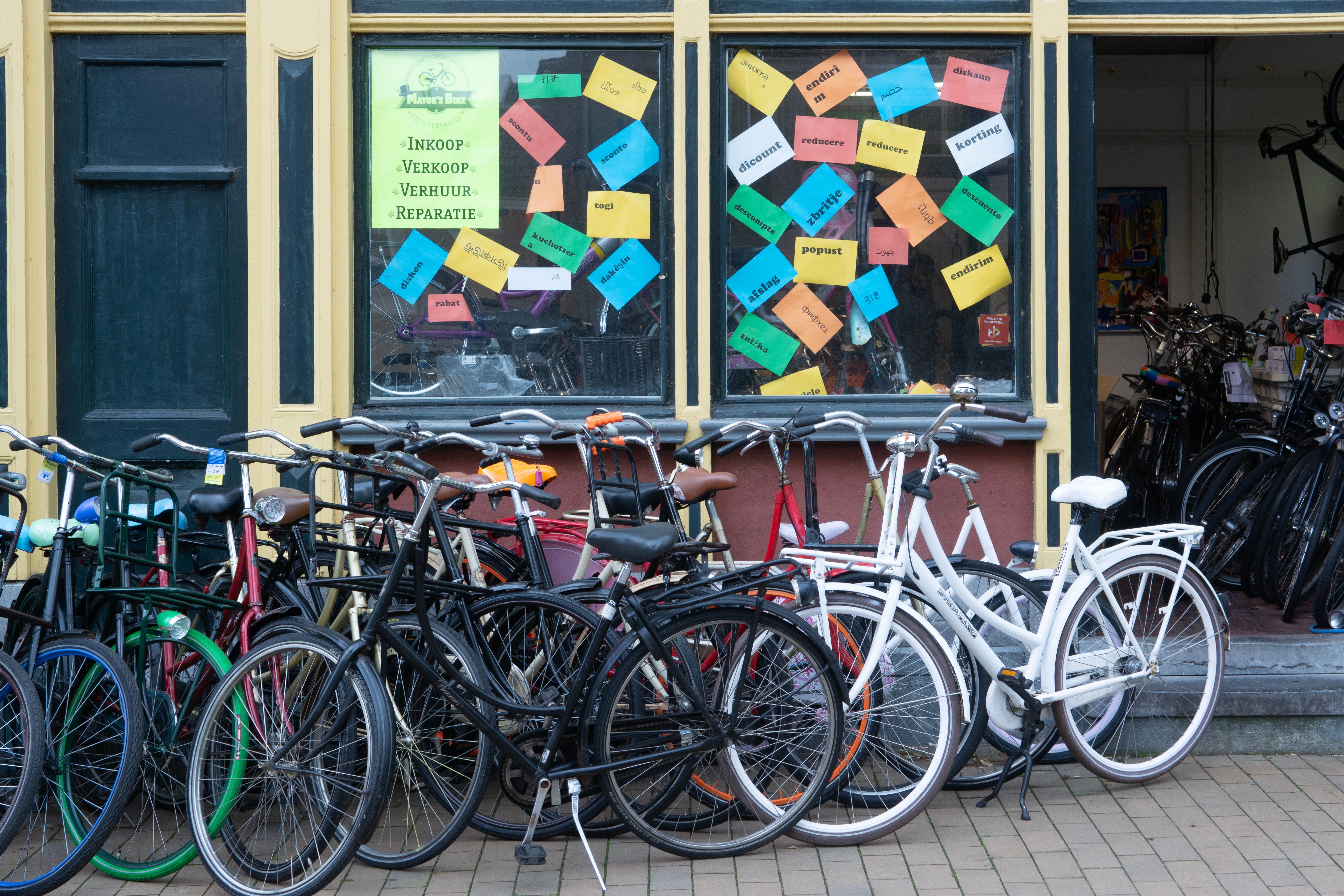 Vibrant Bicycle Shopfront with Colorful Window Display · Free Stock Photo
