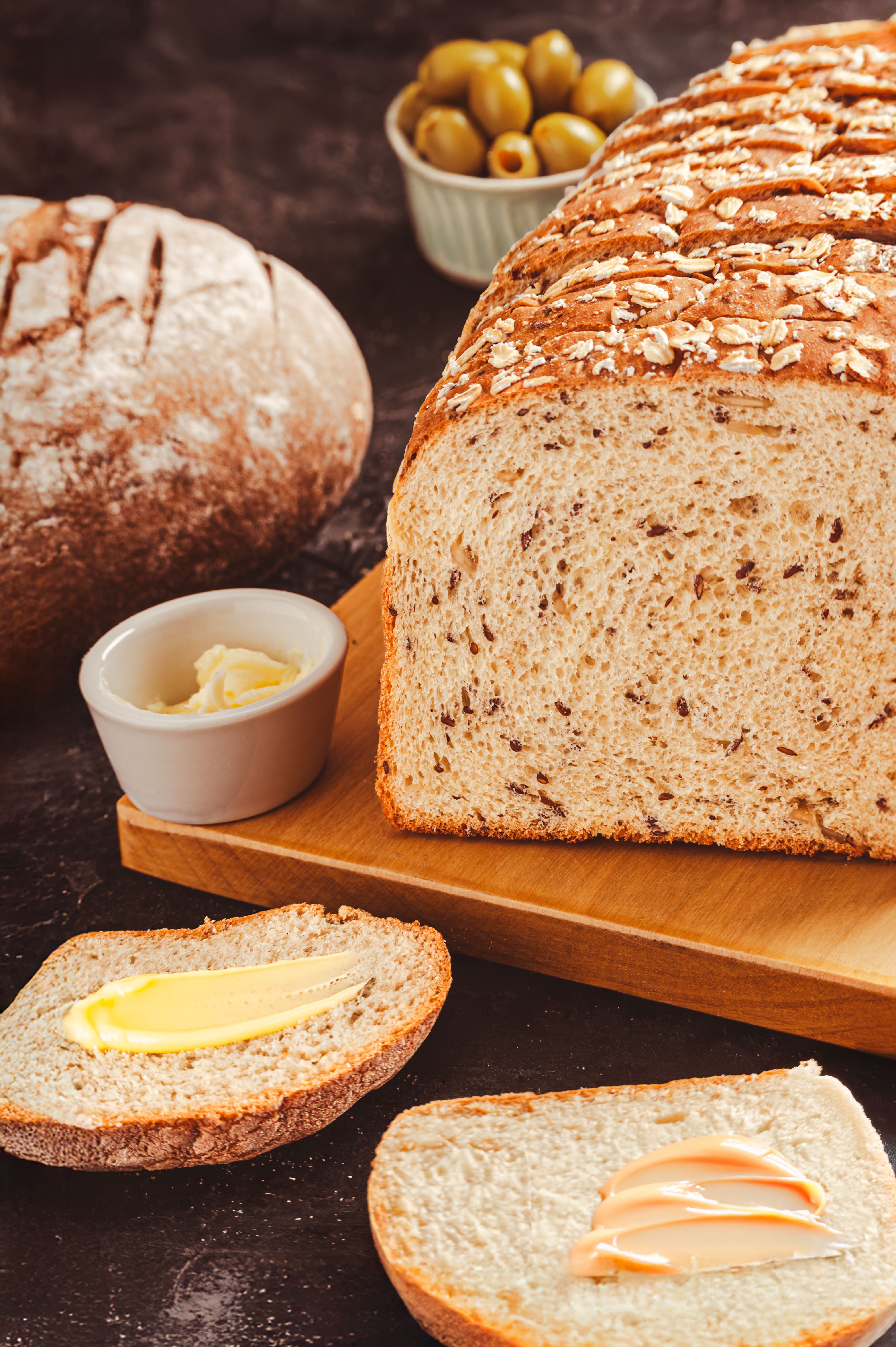 Fresh Artisan Bread with Butter Spread · Free Stock Photo