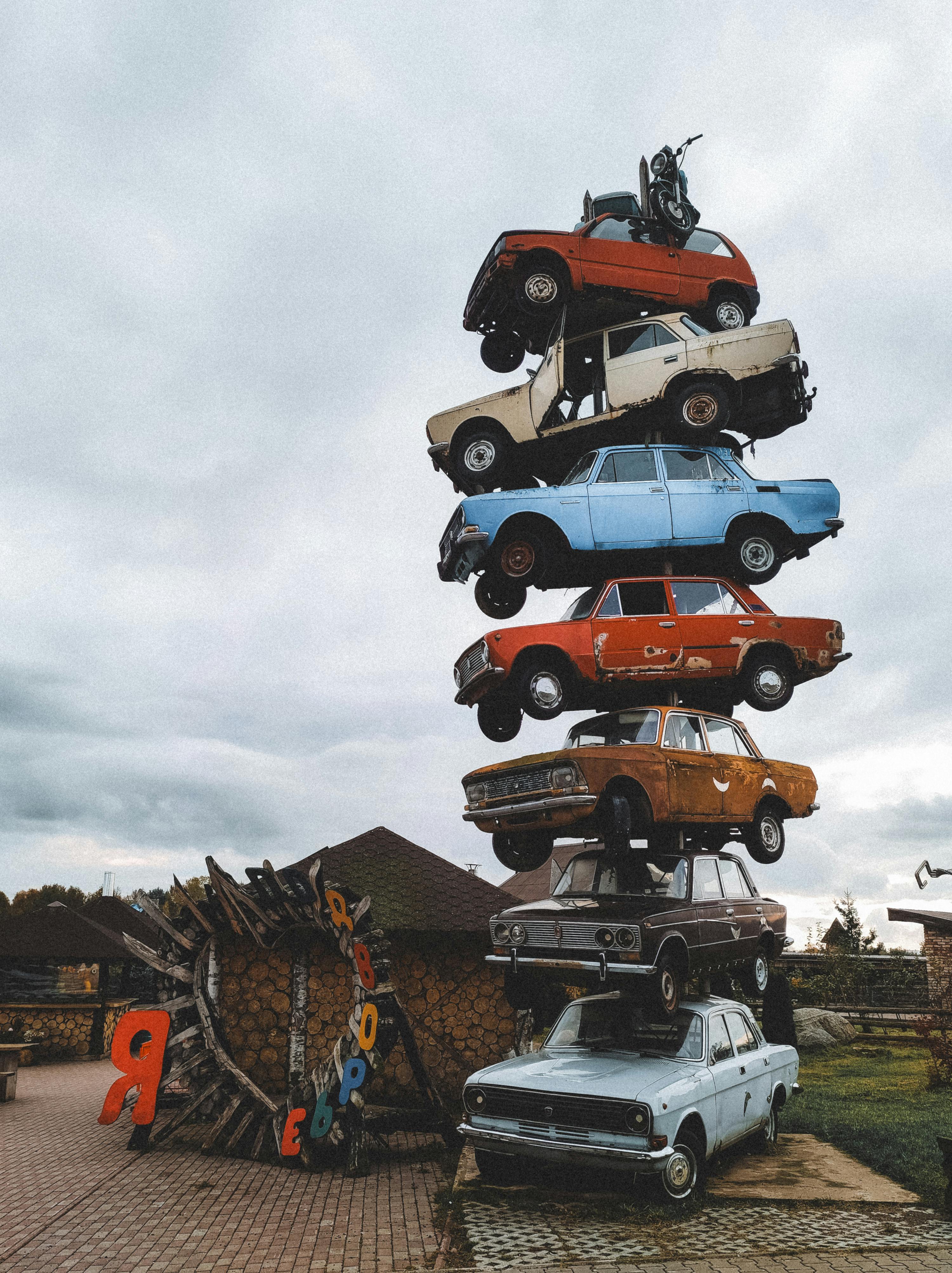 Stacked Vintage Cars Display in Kaliningrad · Free Stock Photo