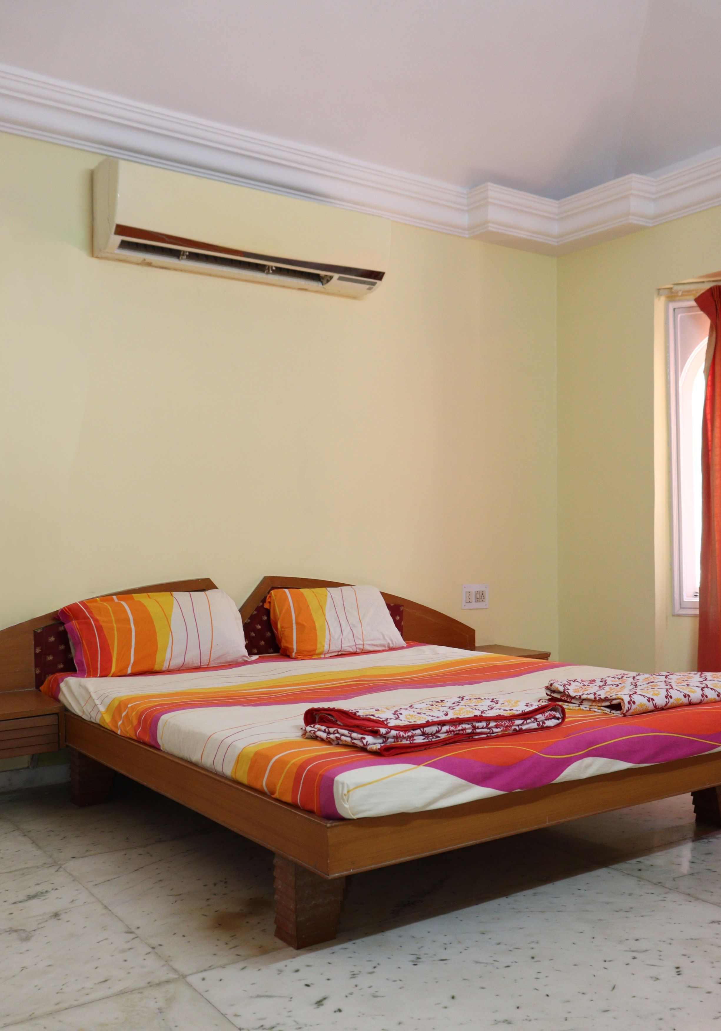 Comfortable Bedroom with Colorful Bedding · Free Stock Photo