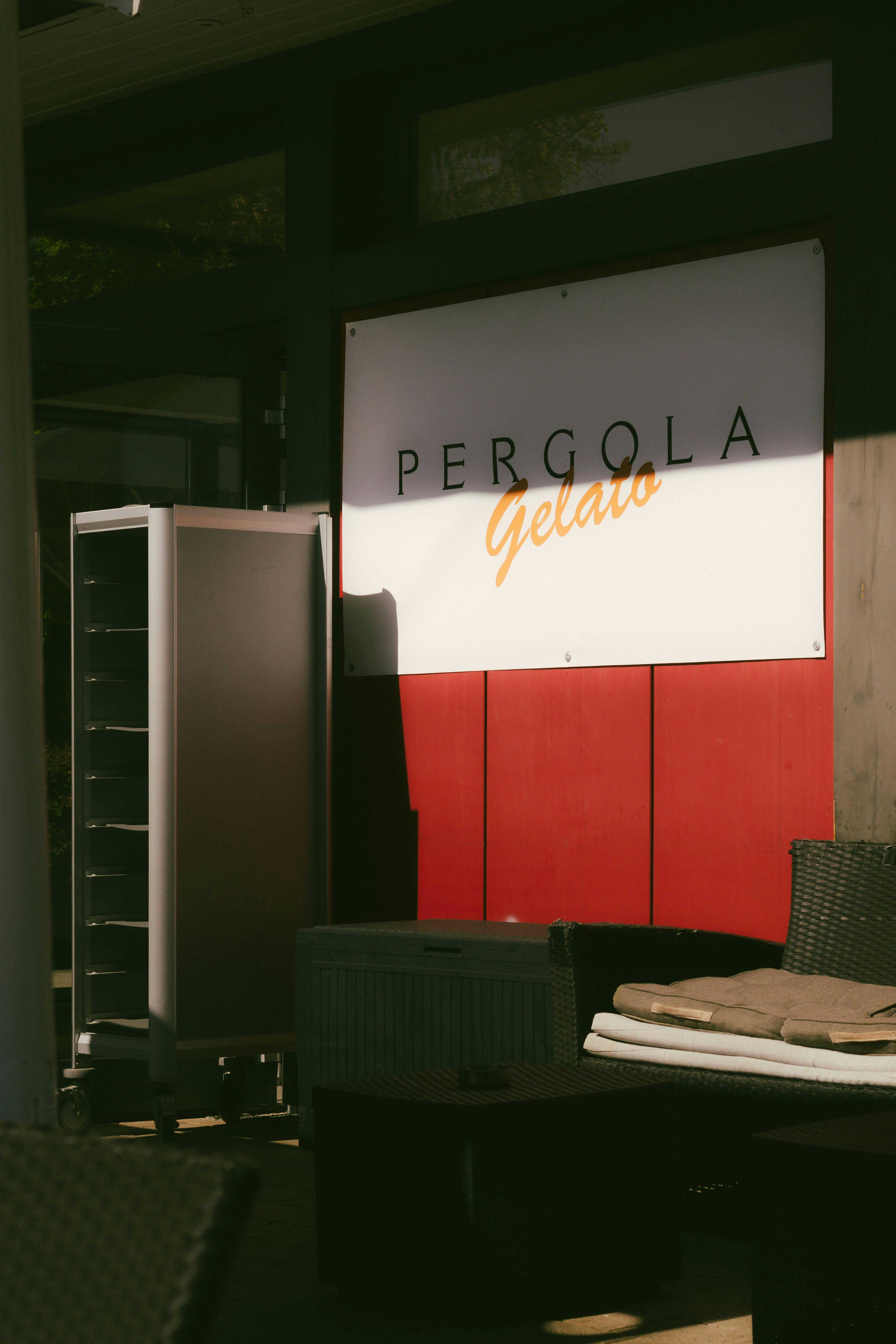 Outdoor Gelato Shop with Pergola Sign · Free Stock Photo