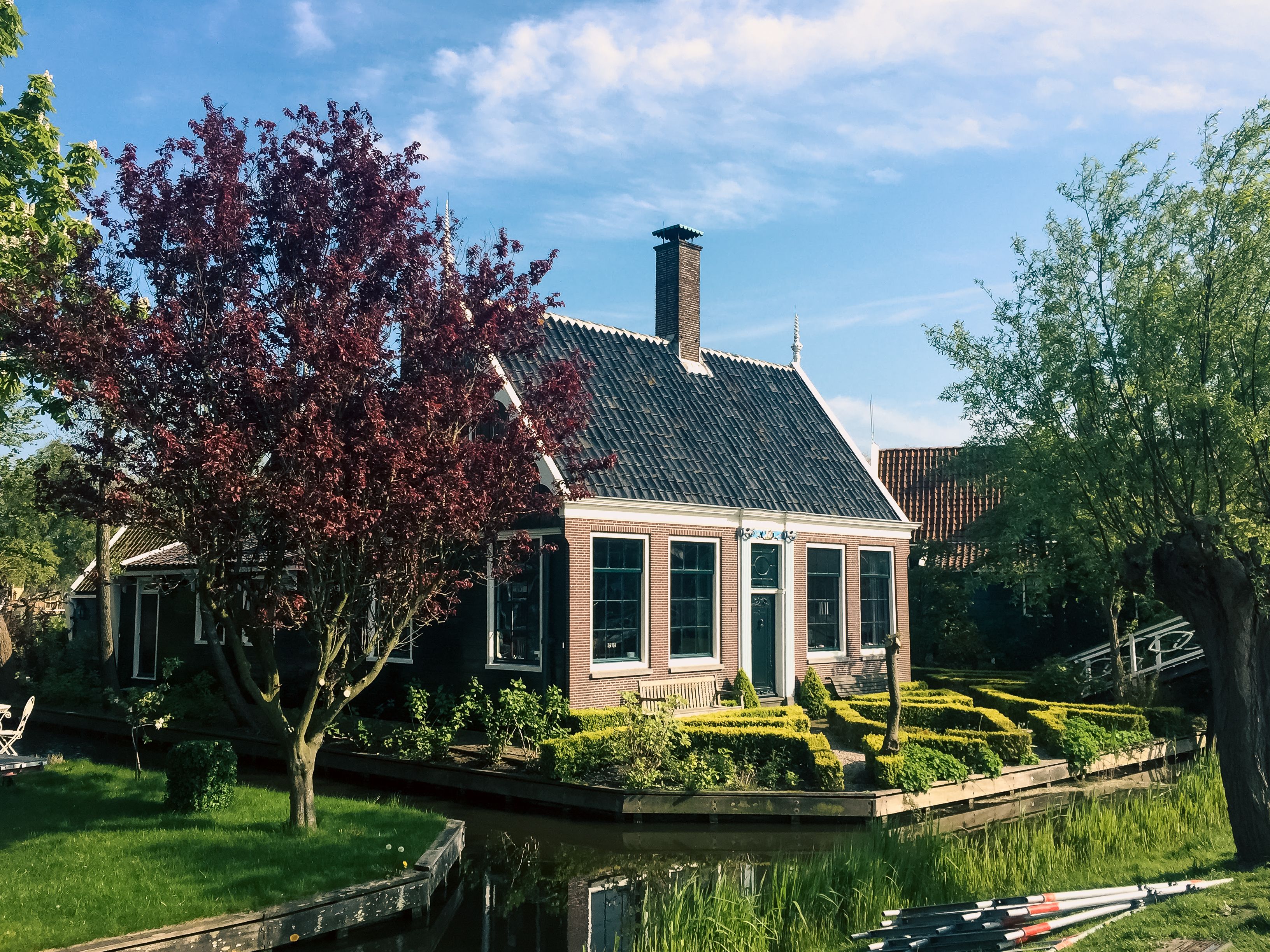 Charming Dutch Cottage by a Canal in Spring · Free Stock Photo