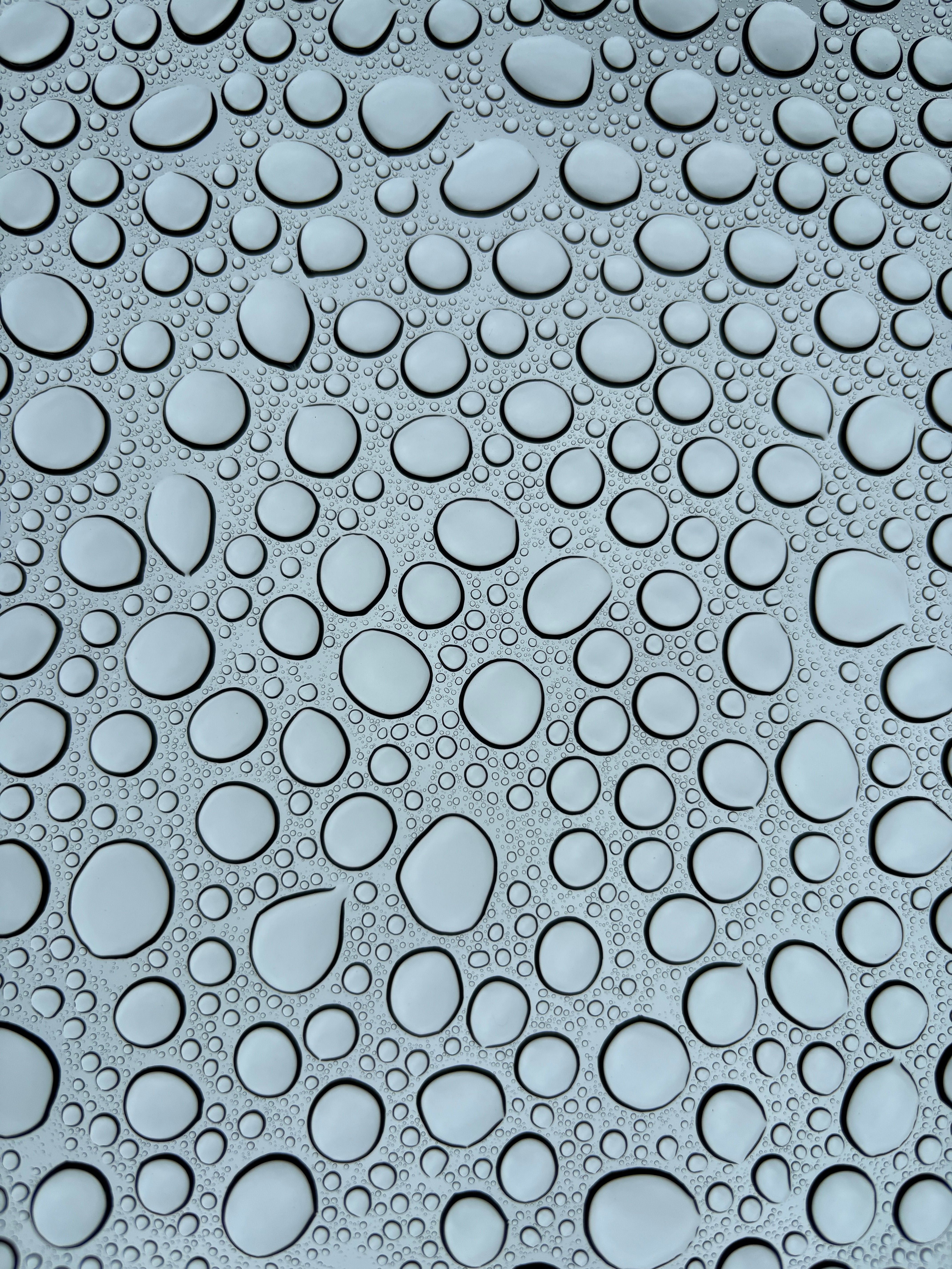 Close-up of Water Droplets on Smooth Surface · Free Stock Photo