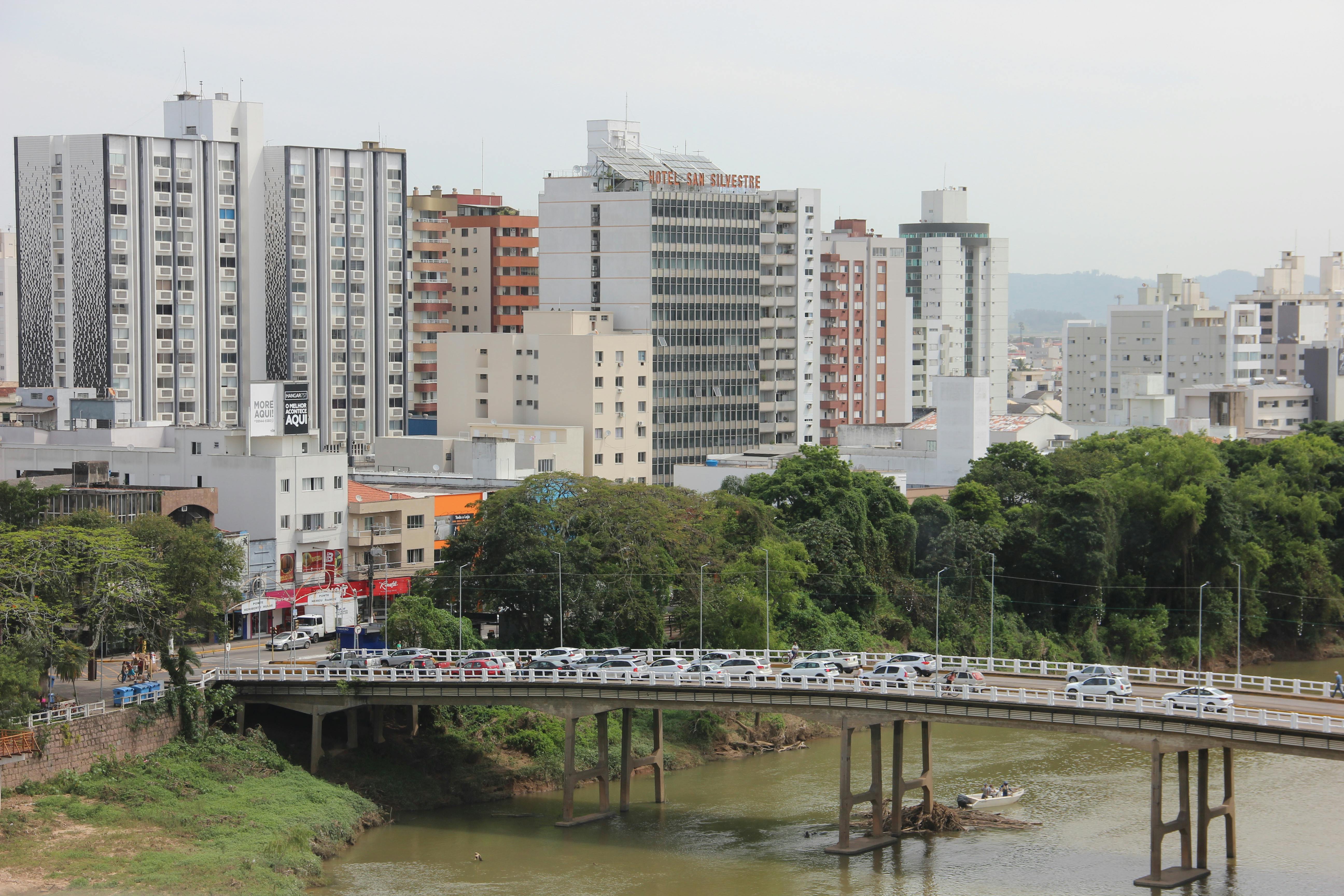 Urban Cityscape with Bridge Over a River · Free Stock Photo