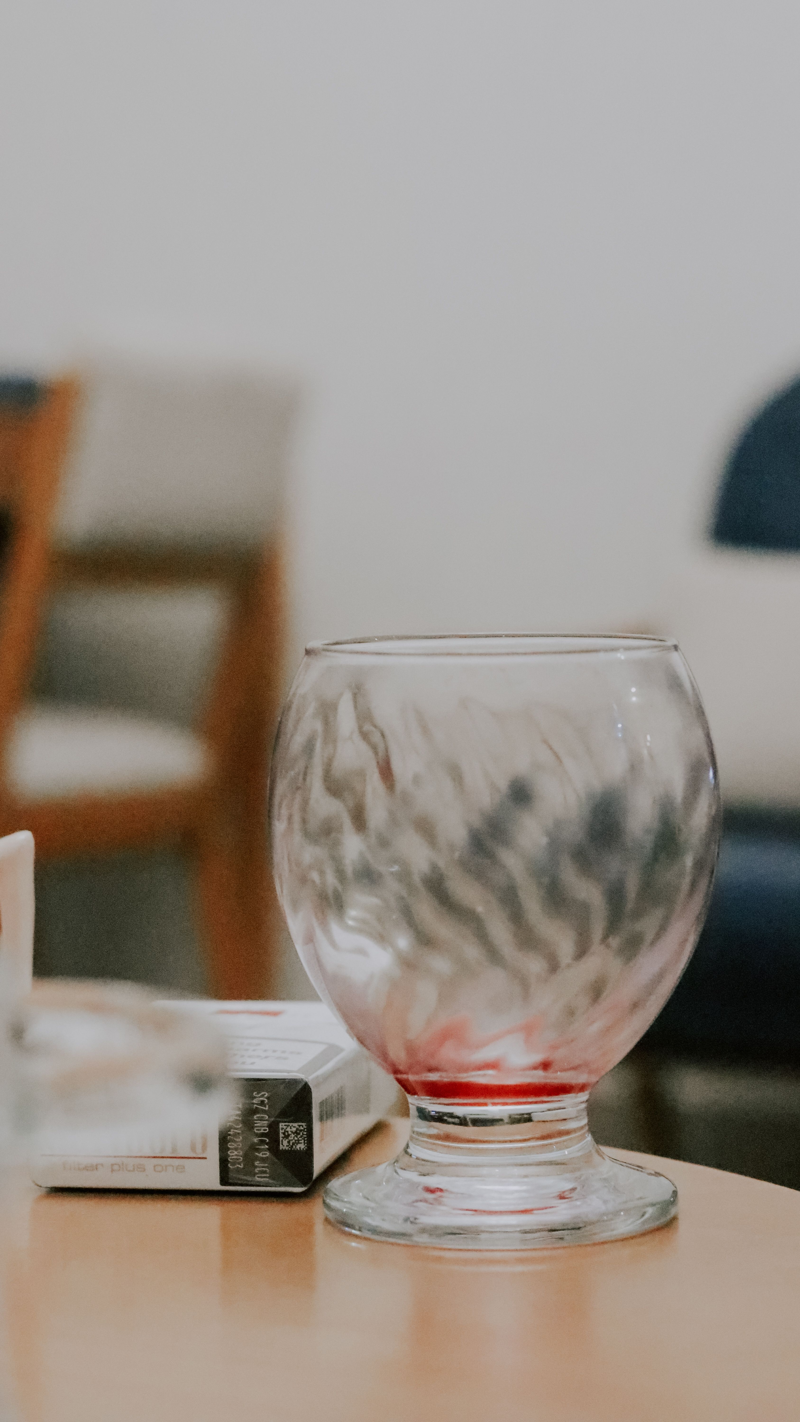 Empty Glass with Red Liquid Residue on Table · Free Stock Photo