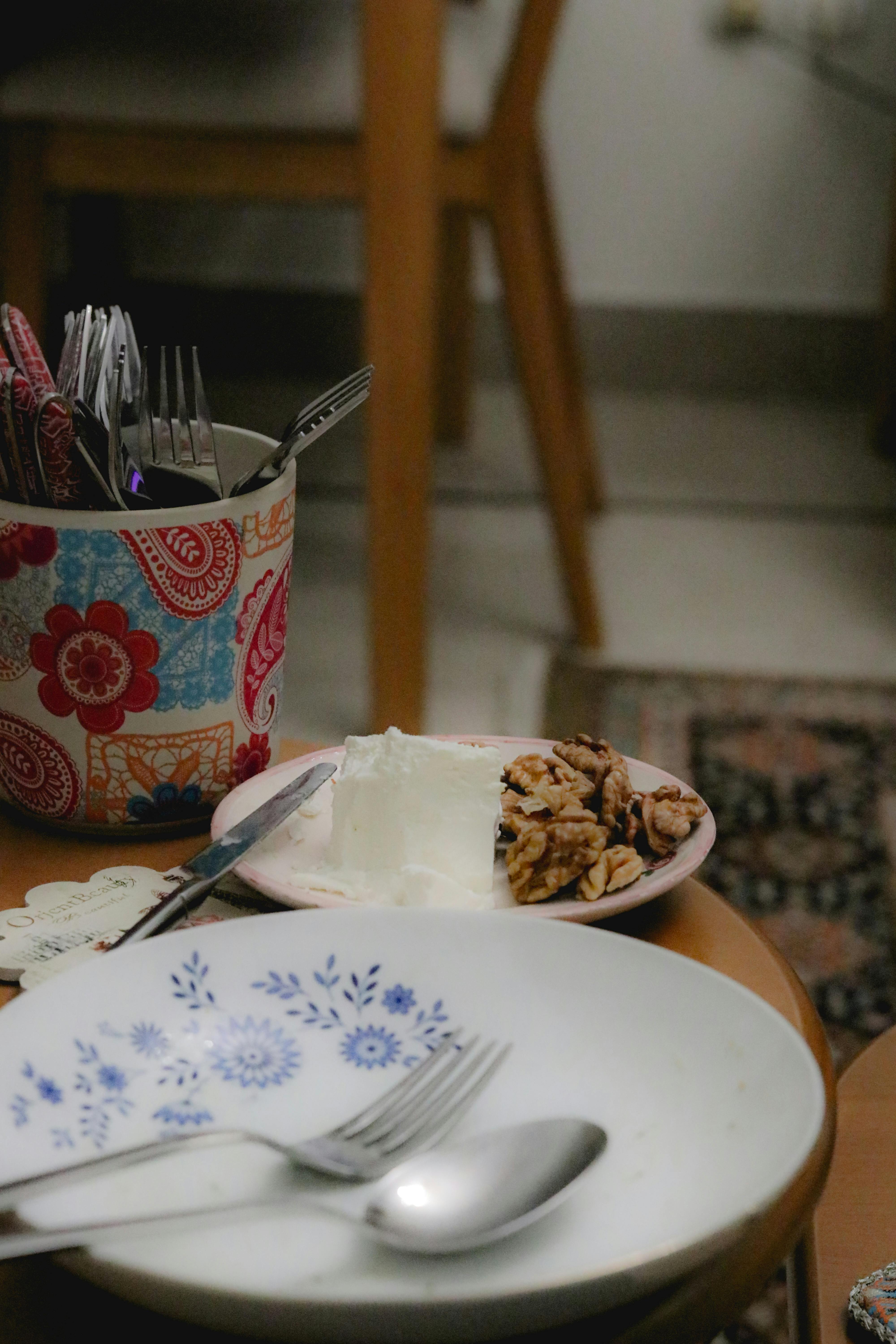 Cozy Indoor Dining Setup with Cutlery and Snacks · Free Stock Photo