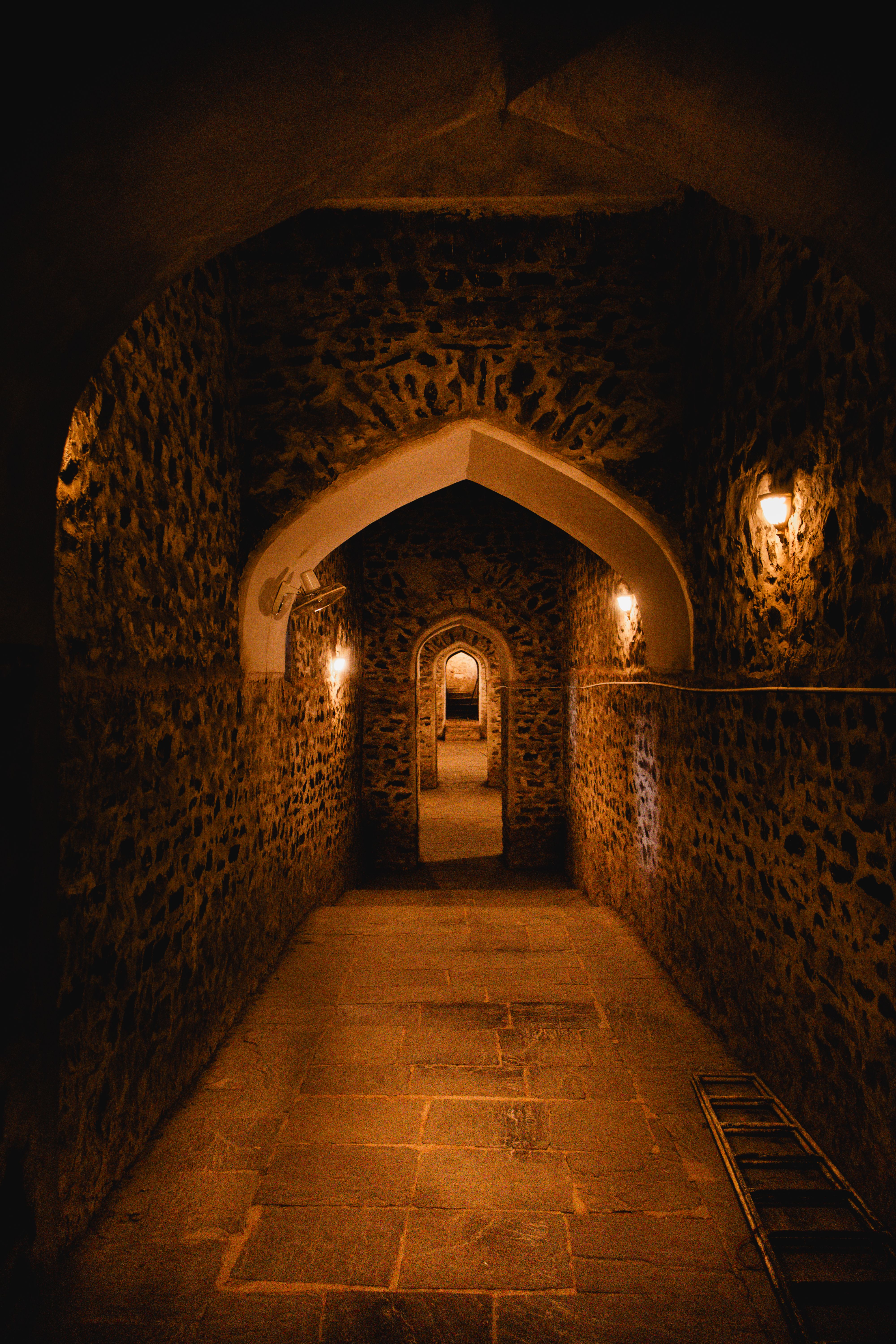 Ancient Stone Corridor with Arched Ceiling · Free Stock Photo